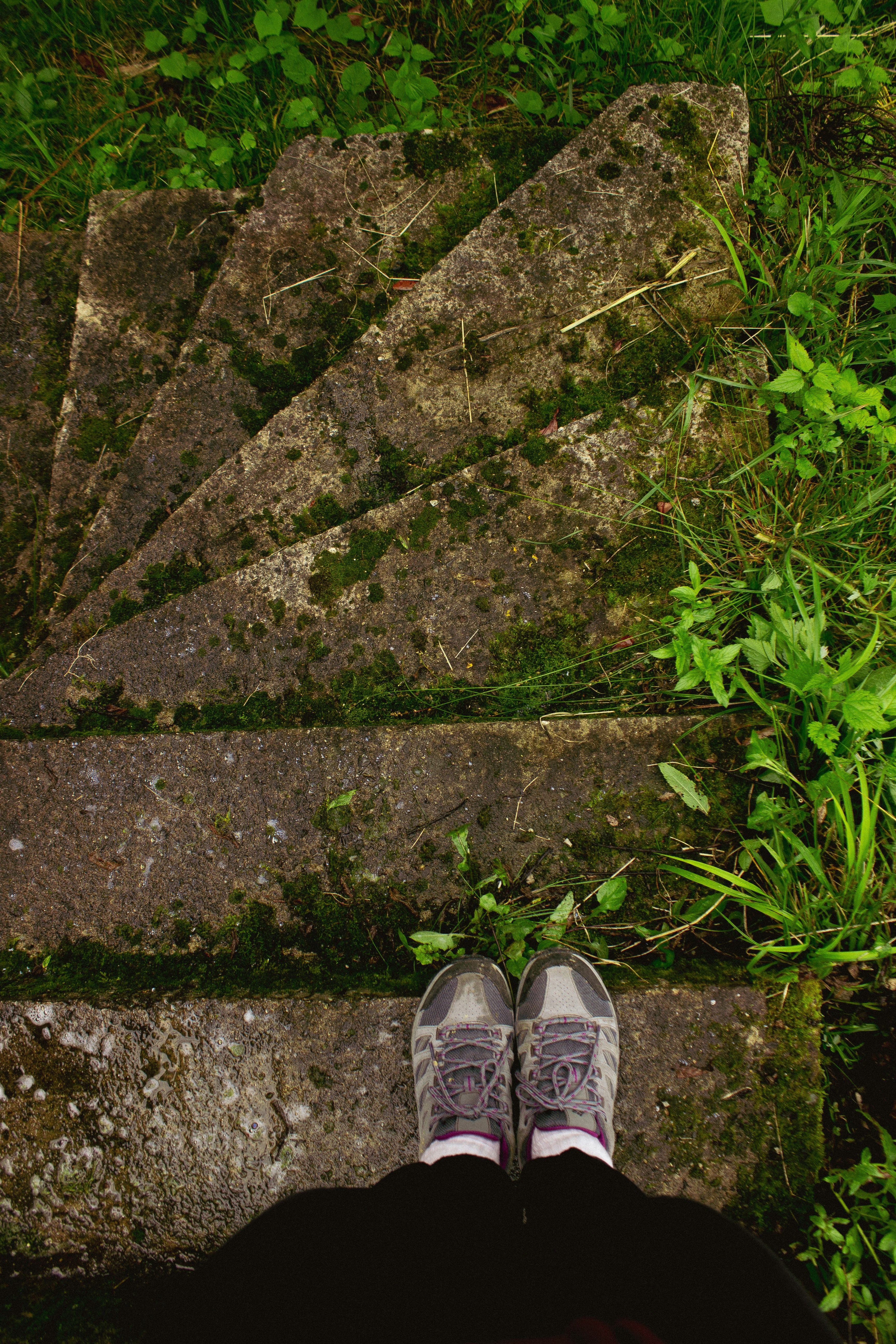 Stepping Down a Moss-Cilt Staircase: Footfall on Weathered Steps