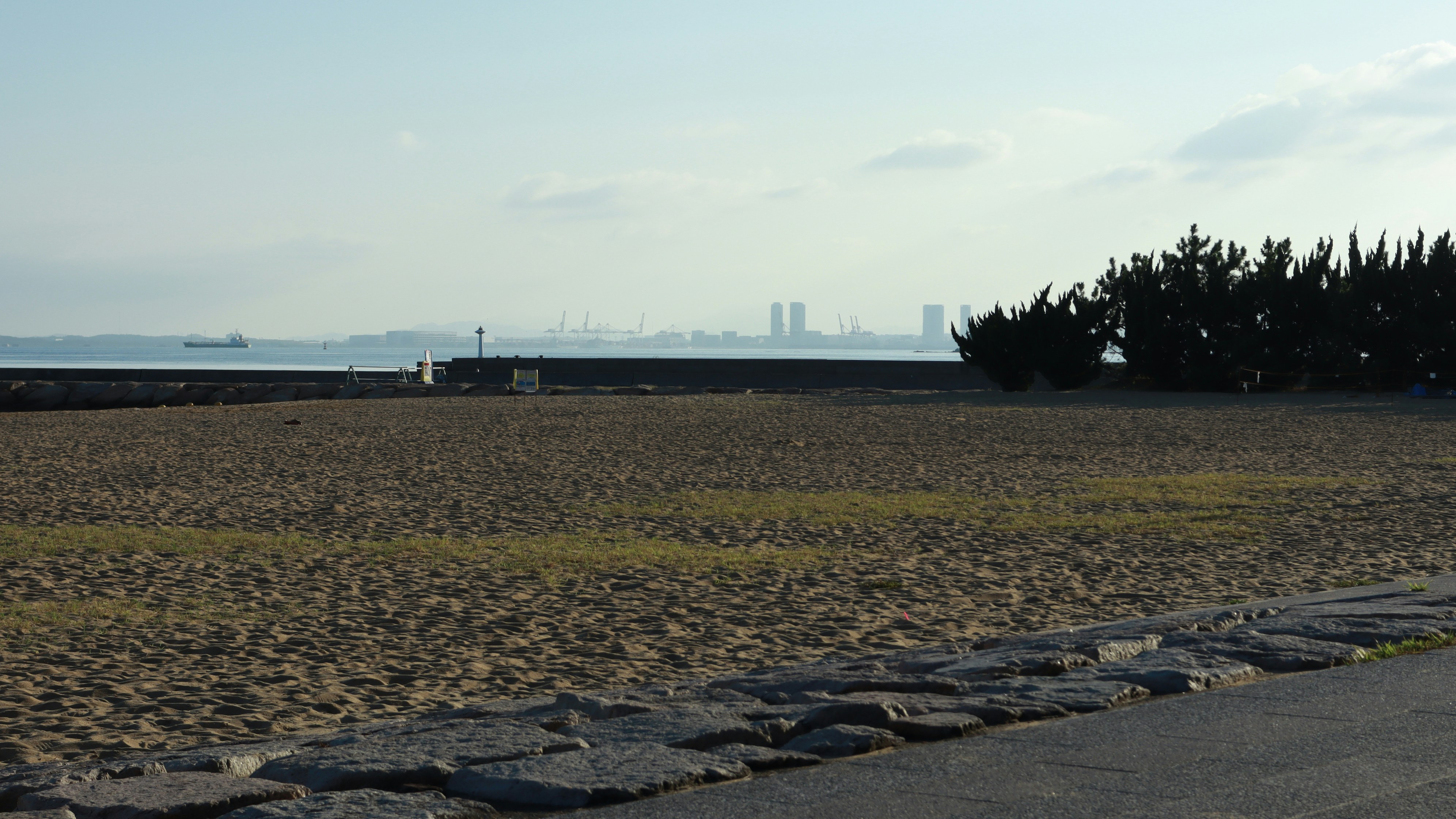 Distant Skyline from a Quiet Seaside Arc