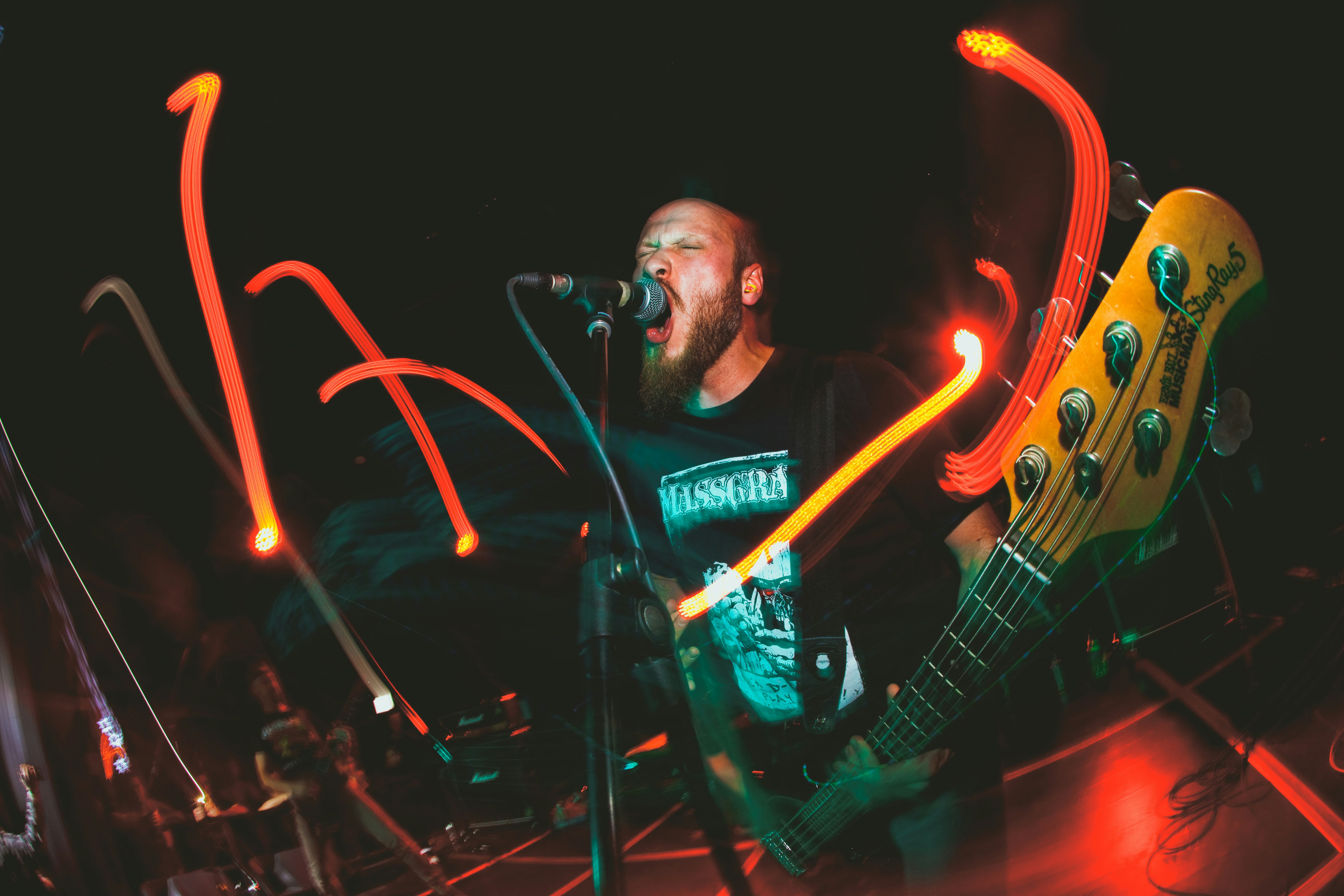 Midnight Jams: A Screaming Bassist Under Neon Trails