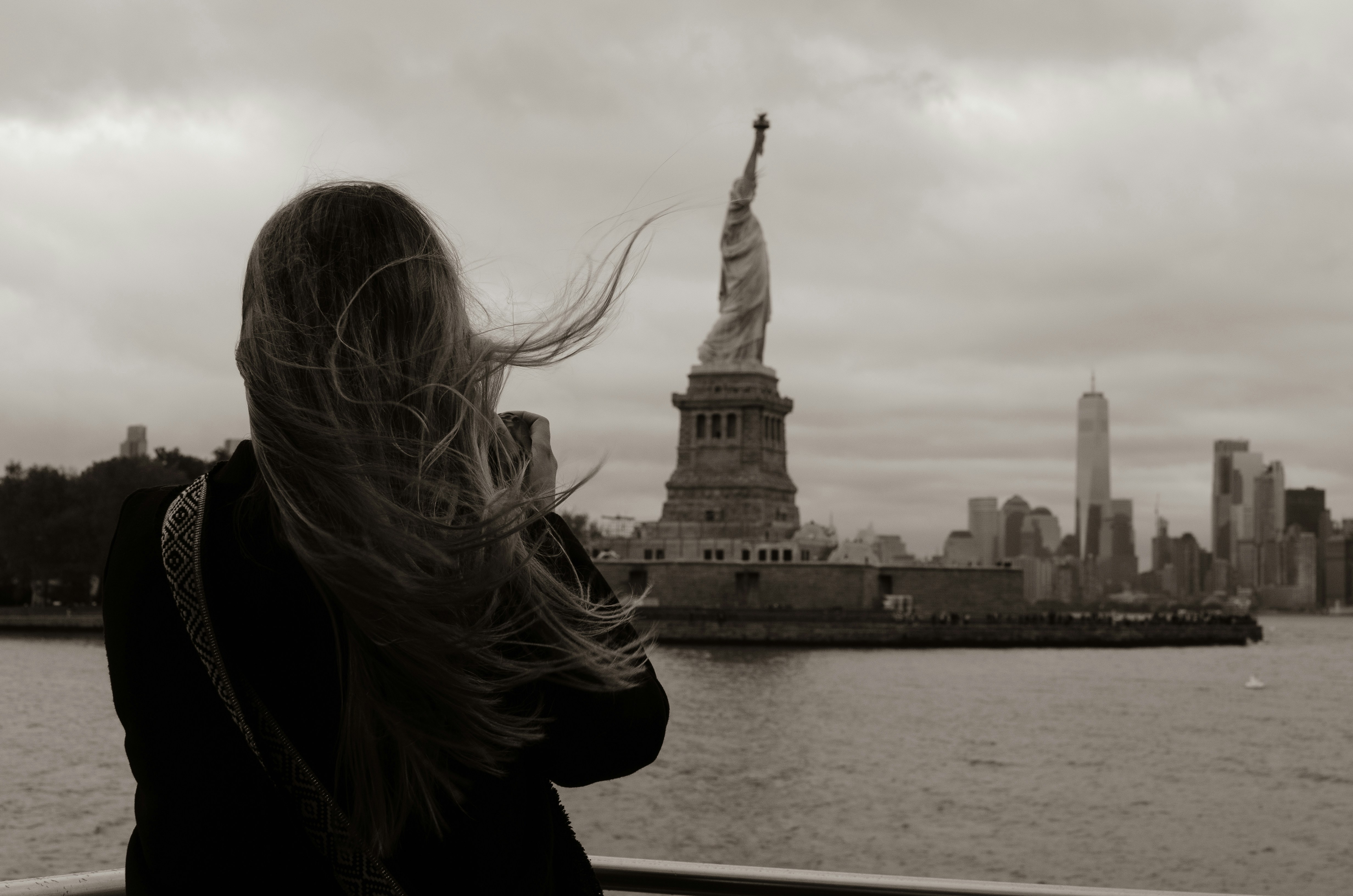 Silhouette in a Wind-Struck Moment by the Statue of Liberty