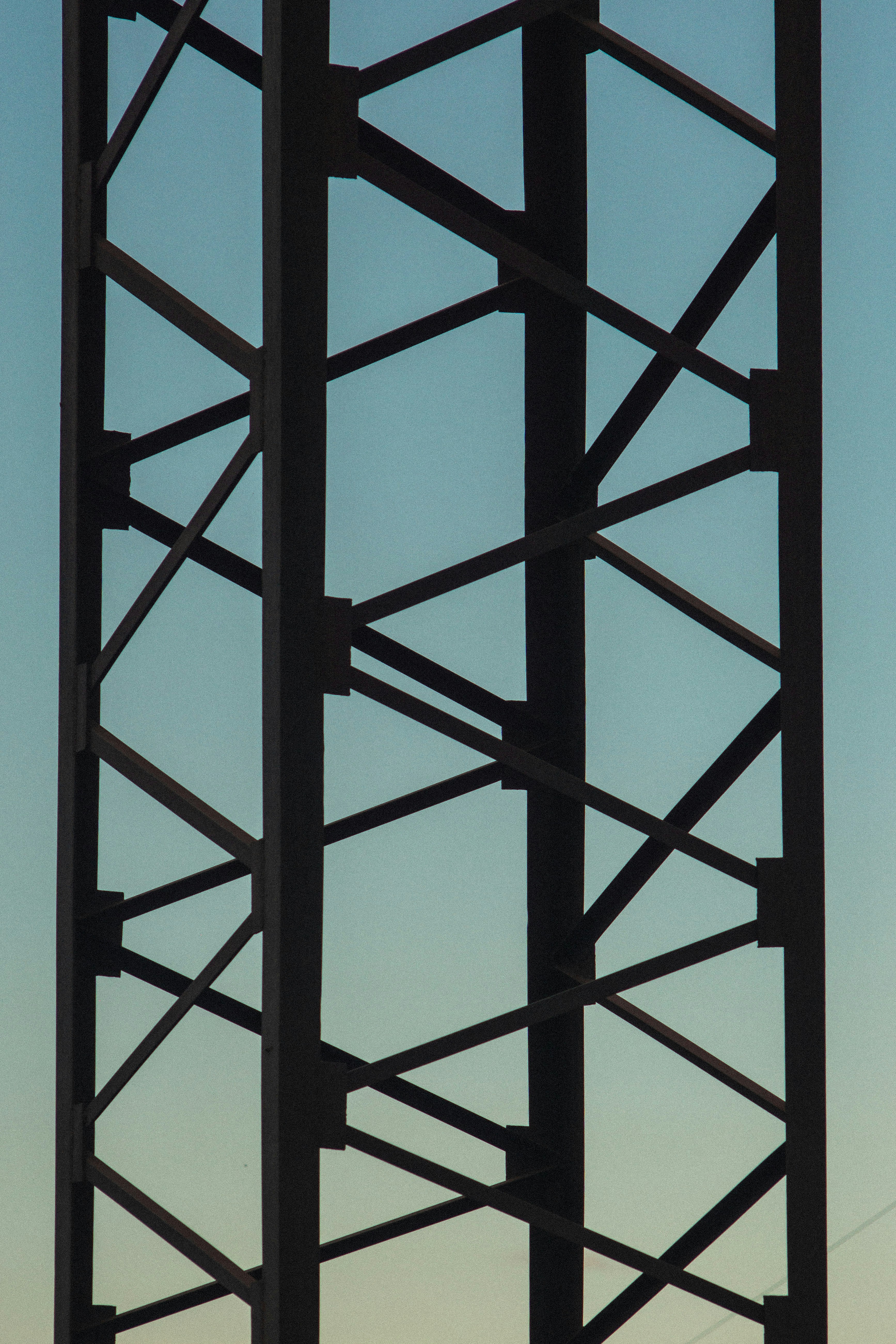 Crisscross of Steel: Structural Lattice Against A Quiet Gradient Sky