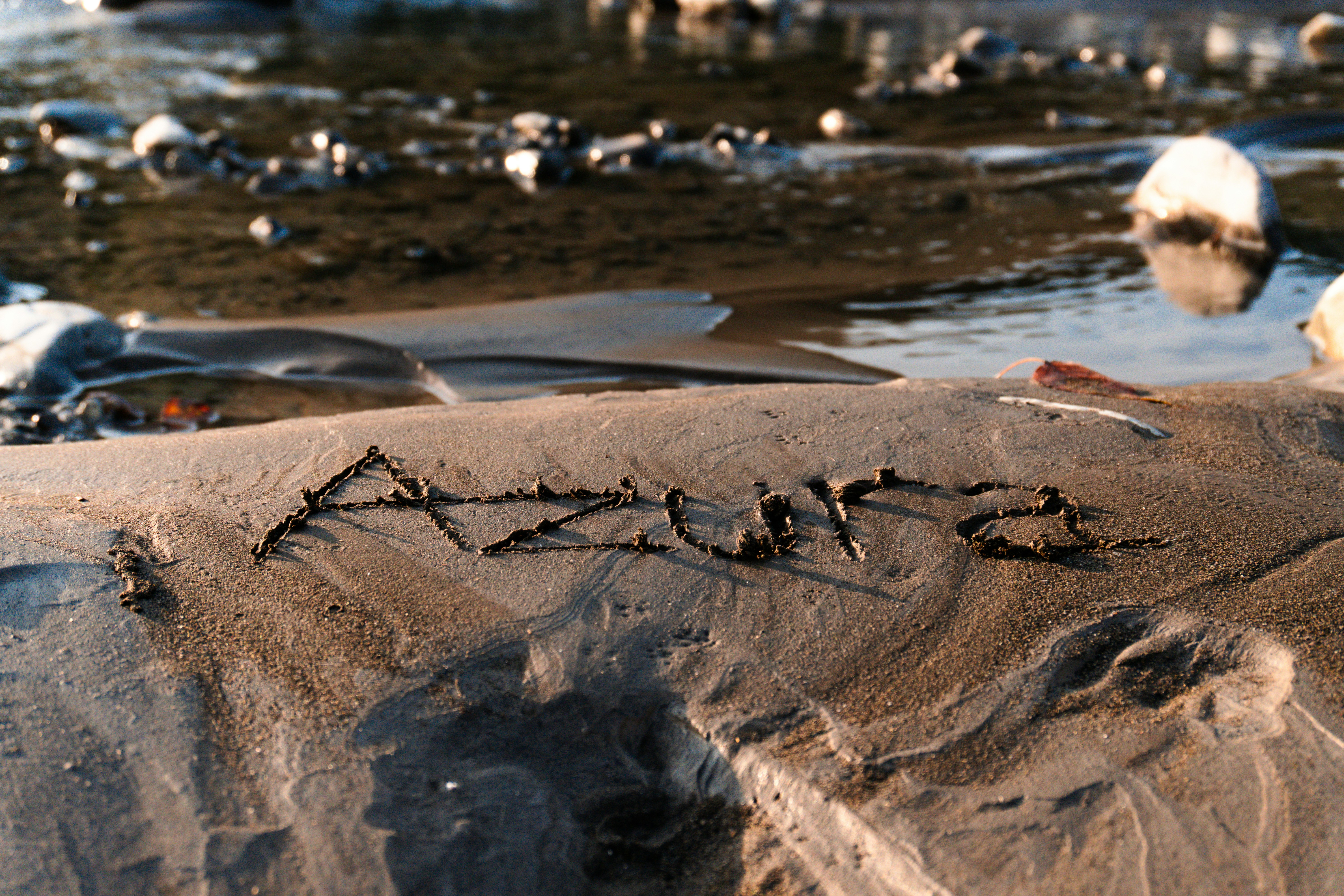 Footprints of a Message in the Sand by a Riverbed