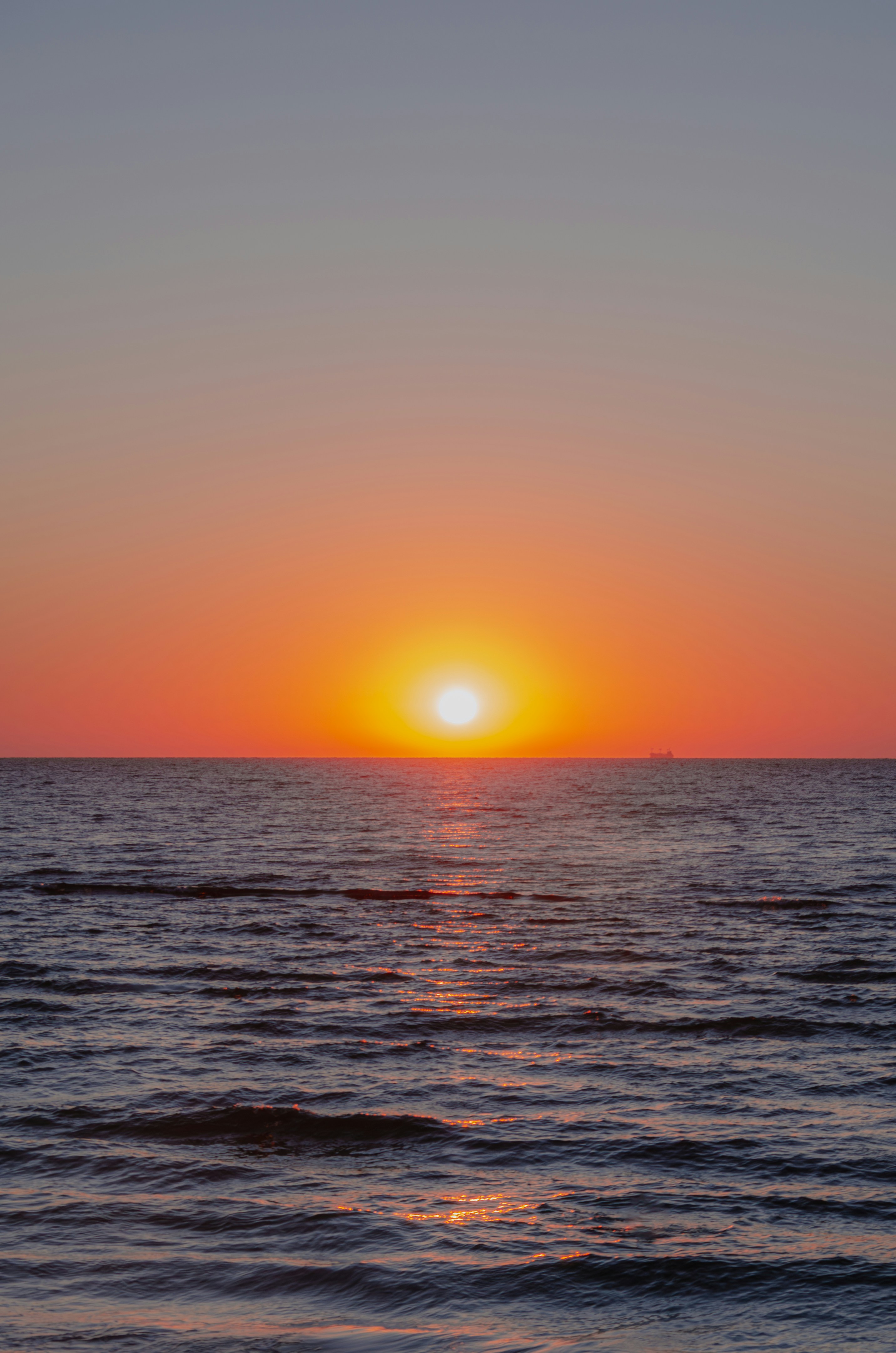 Sunlit Horizon: A Quiet Sea at Dusk