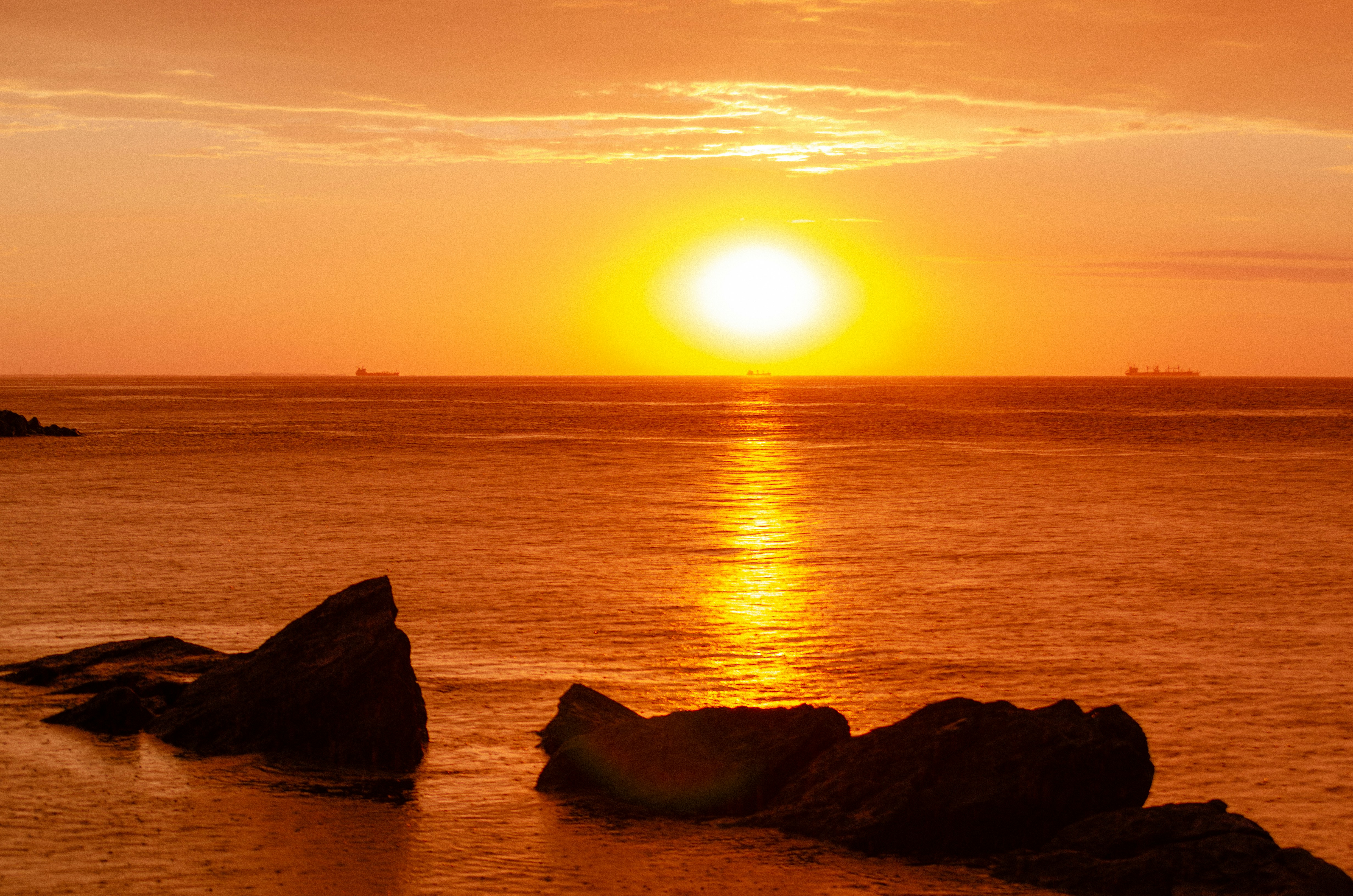 Solar Pier: Sunset over Quiet Rocks