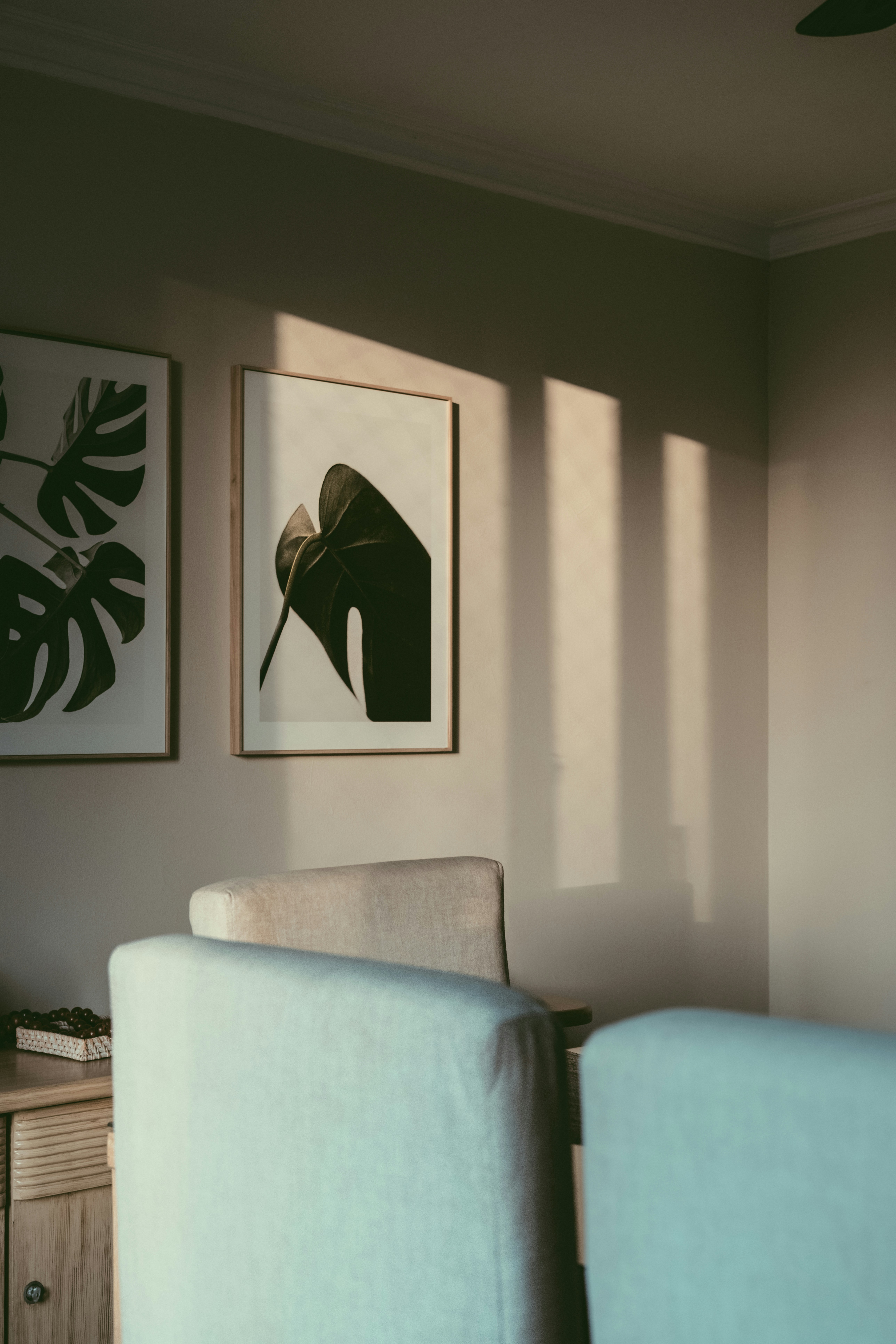 Soft Sunlit Corners: Monstera Art and Quiet Seating