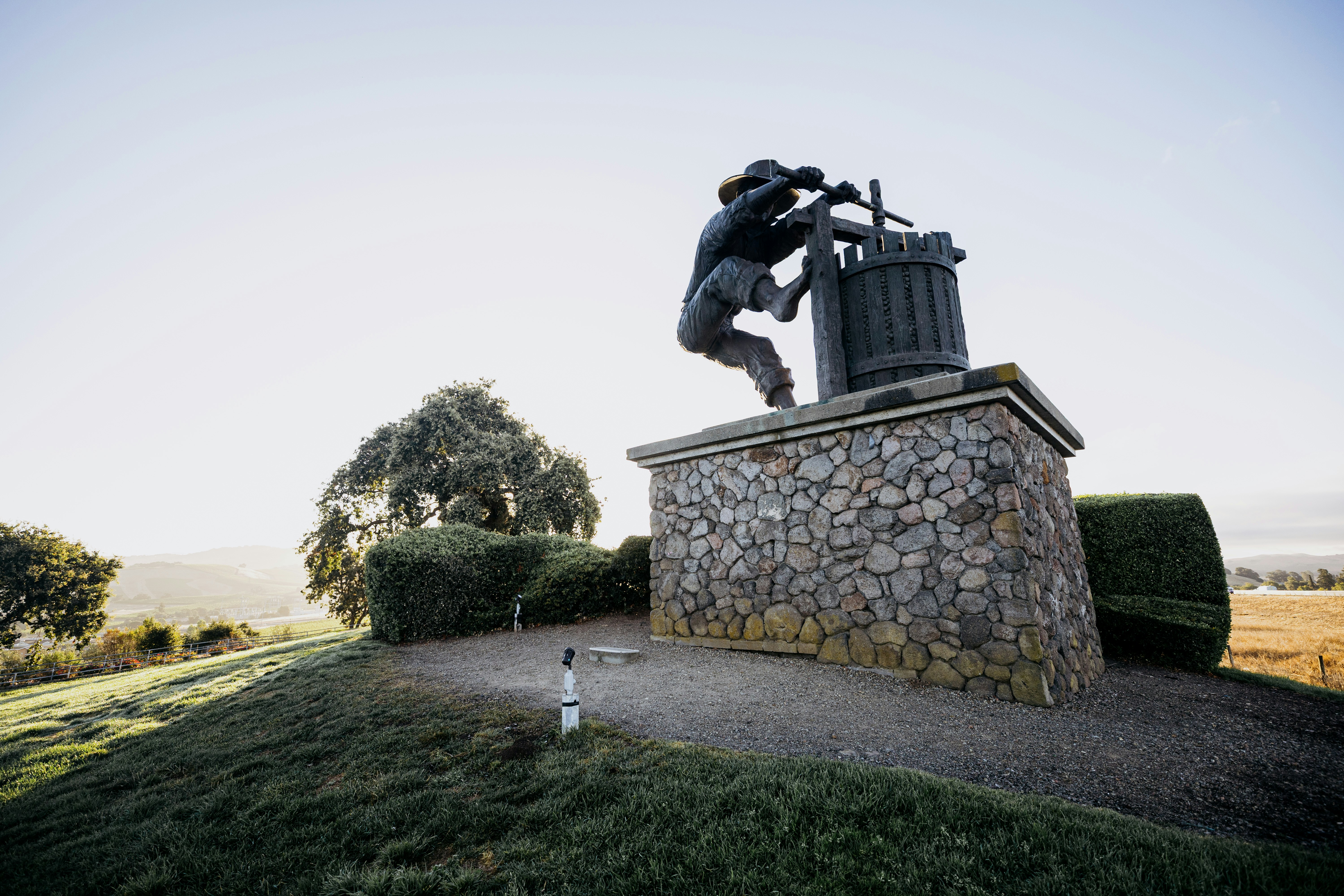 The Milestone Keeper: A Heroic Stone Figure Guarding the Hill