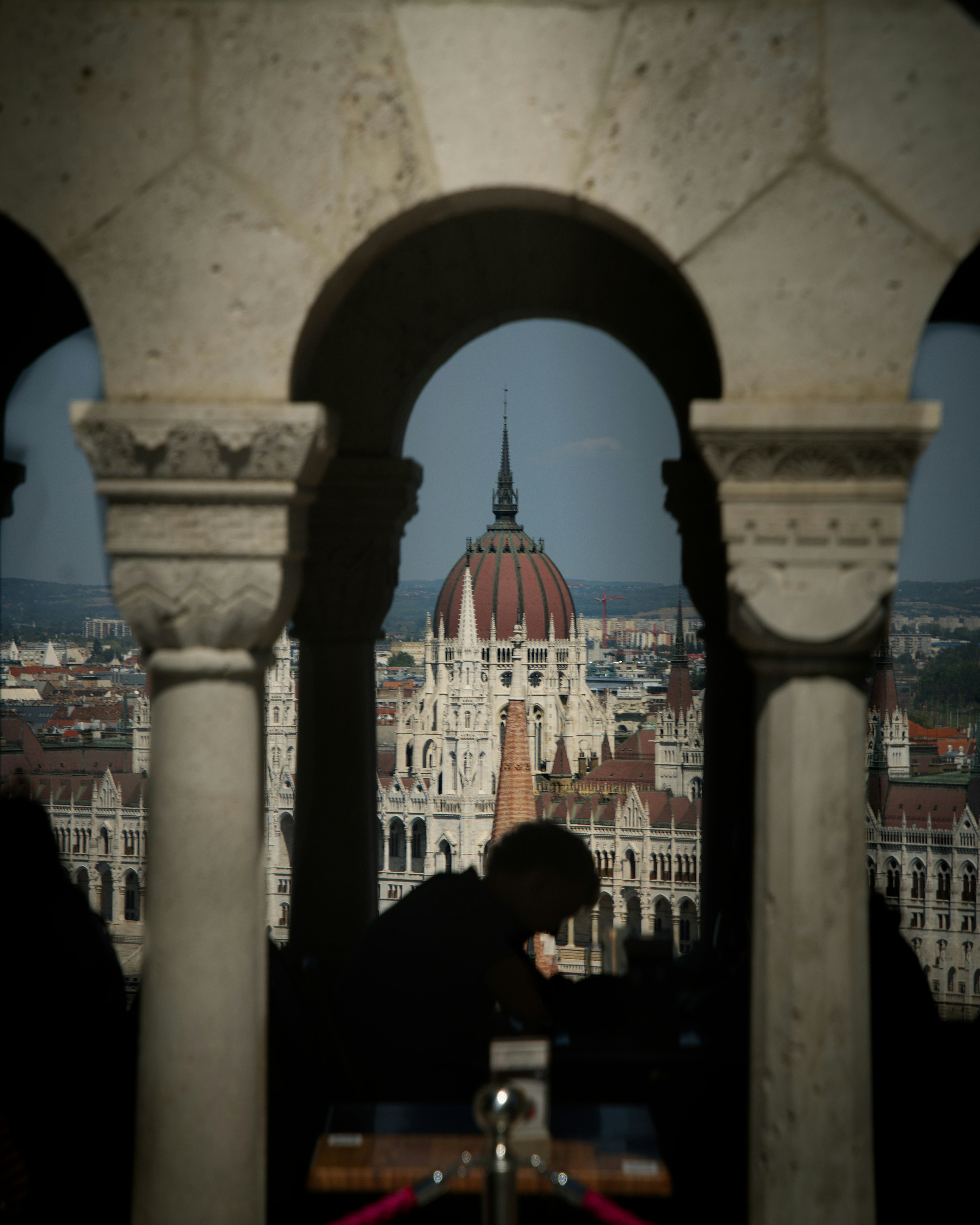 Through Archways to the Hungarian Parliament: Framed Vista over Cast Shadows