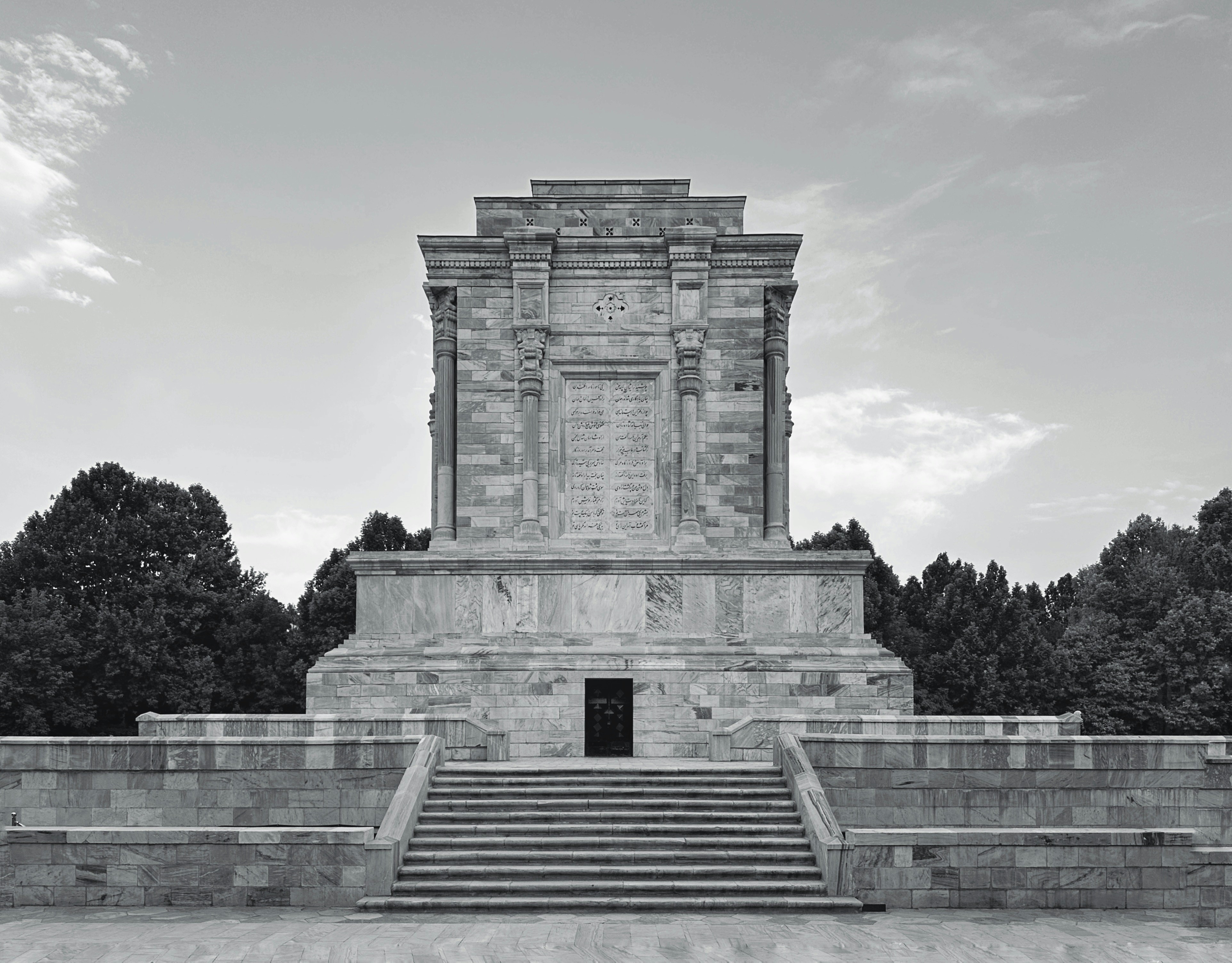 Stone Obelisk Summit: Steps Up to a Monumental Facade