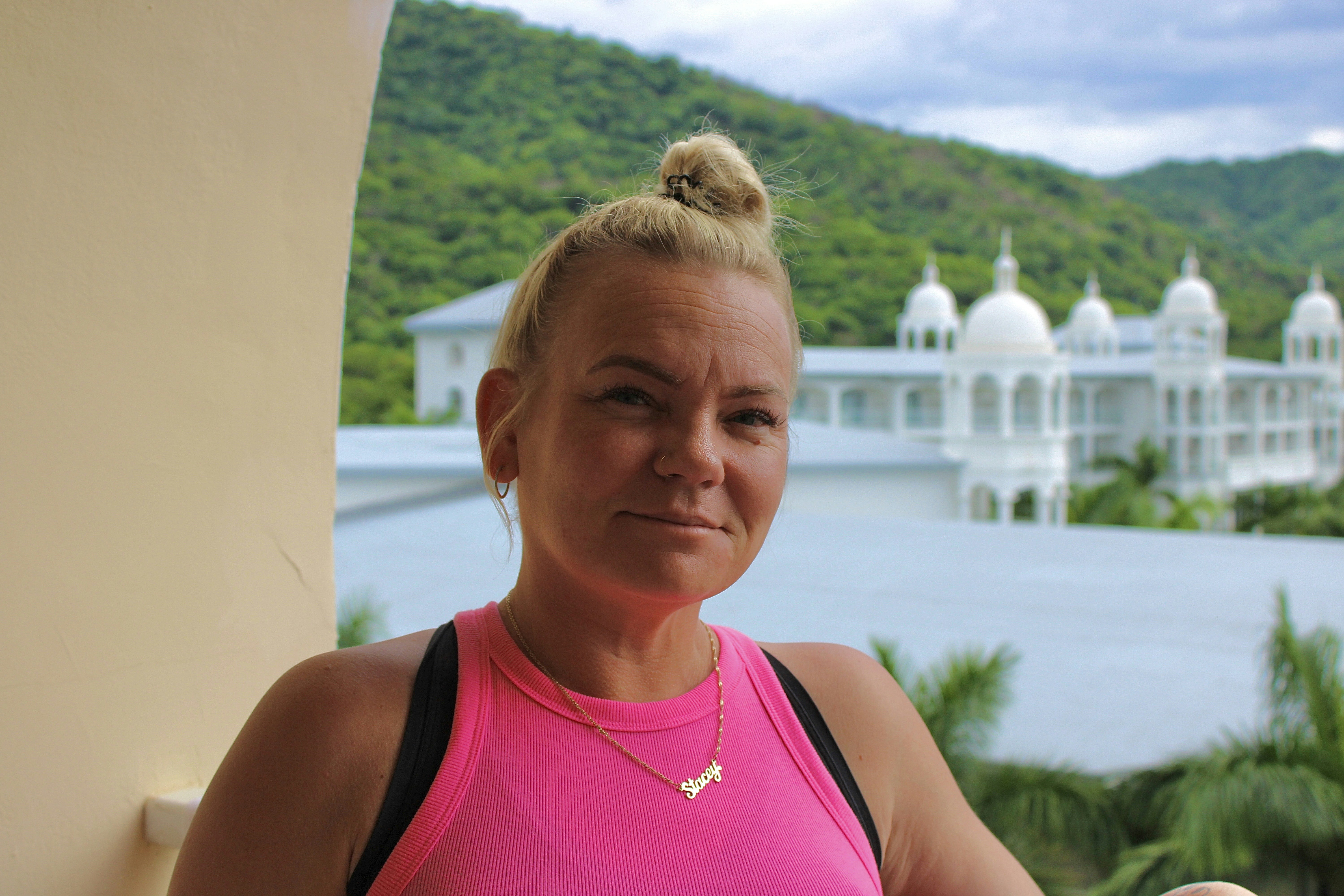 Sunlit Confidence: A Portrait on a veranda with white domed architecture