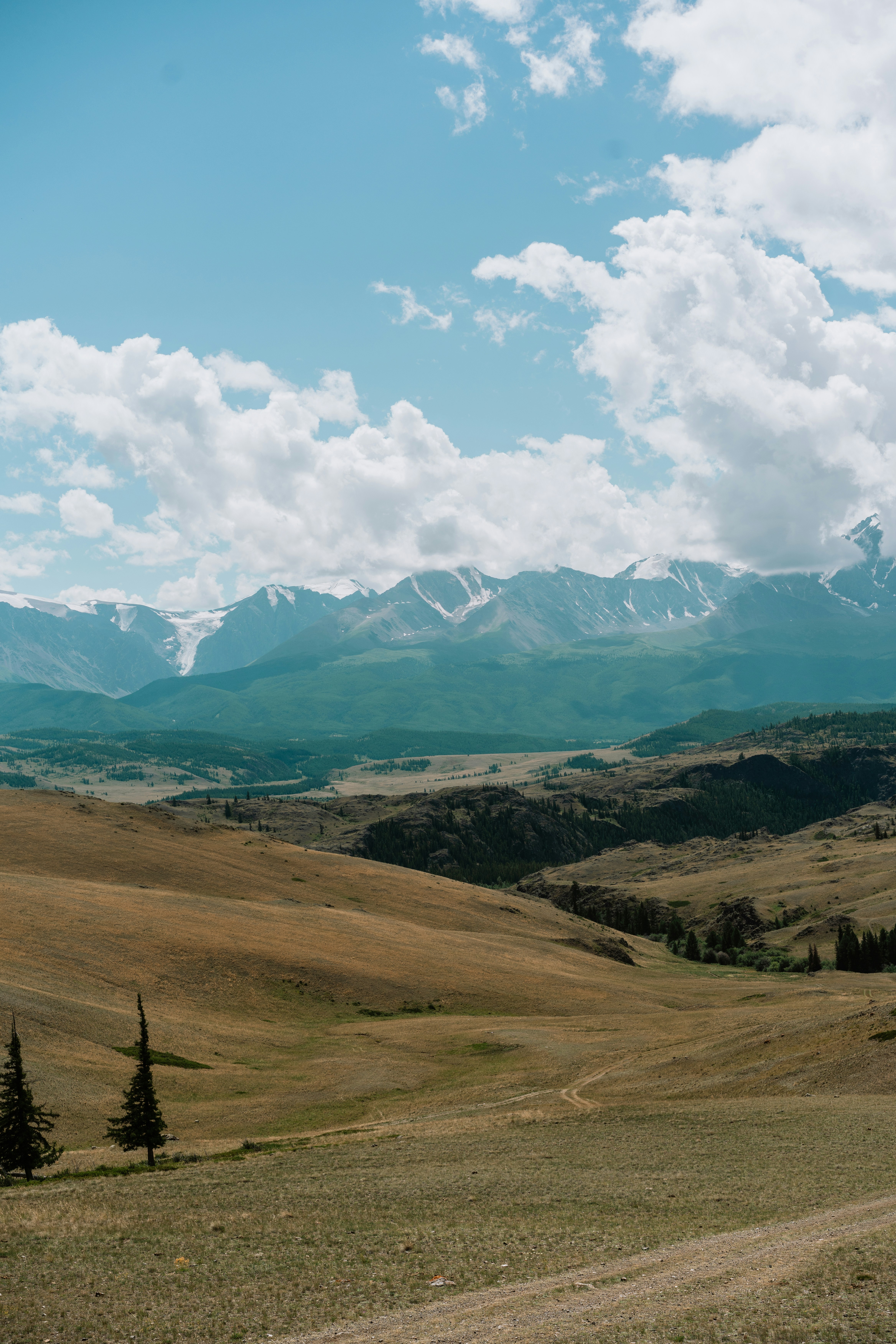Wide Open Ridge: Alpine Valley under a Cloud-Cilled Sky