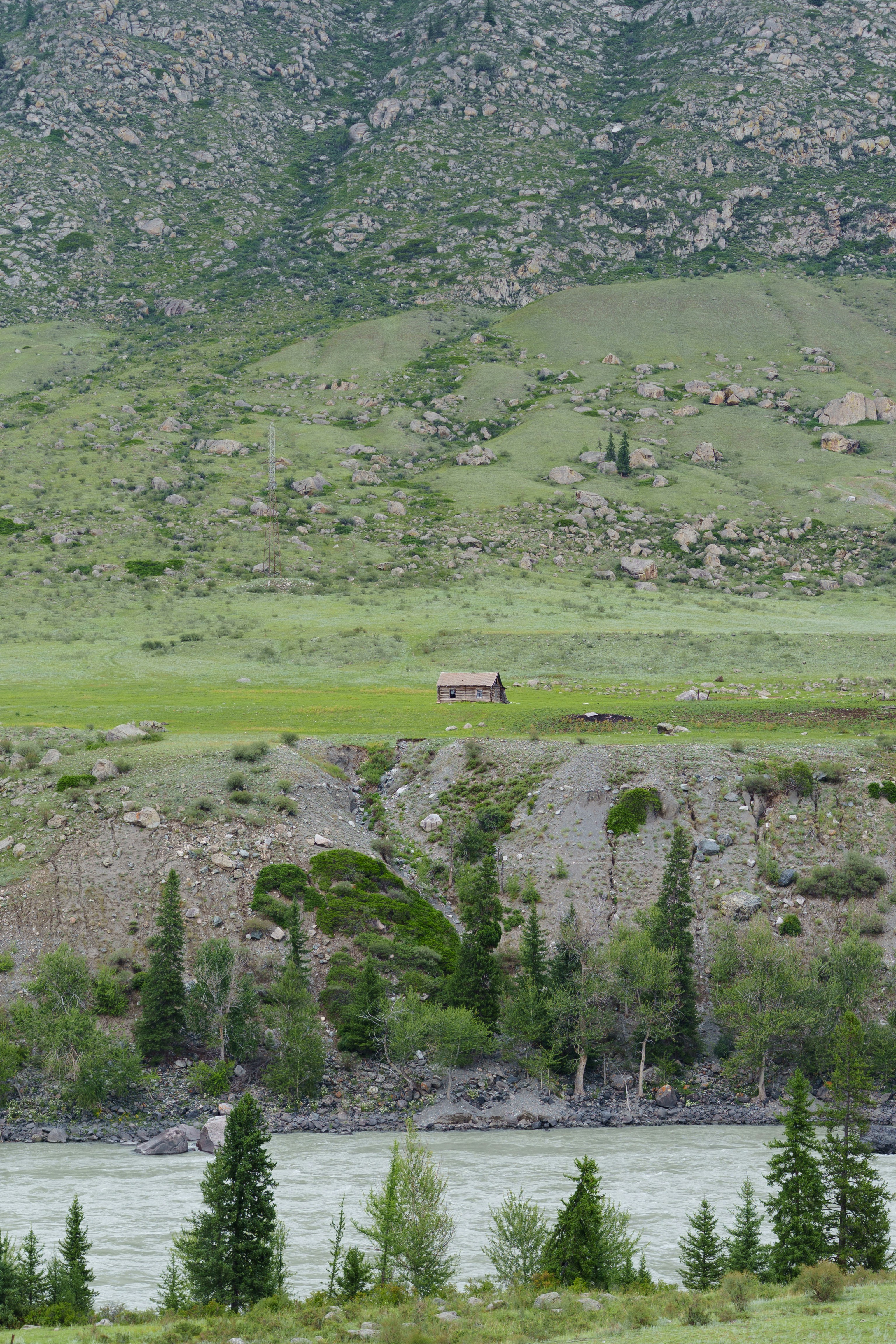 A Lone Cabin at the Foot of Verdant Hills