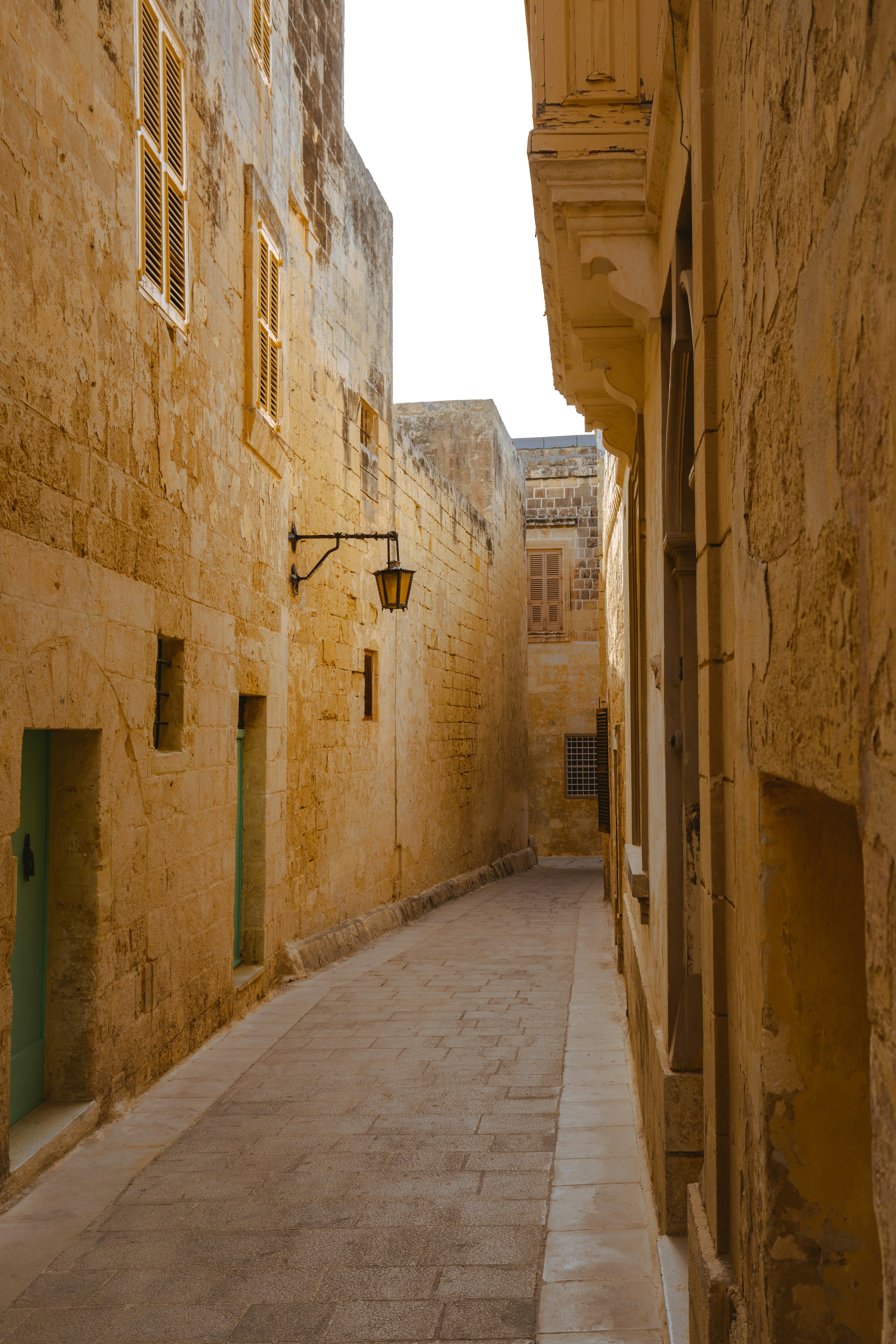 Sunlit Alleyways of Golden Limestone
