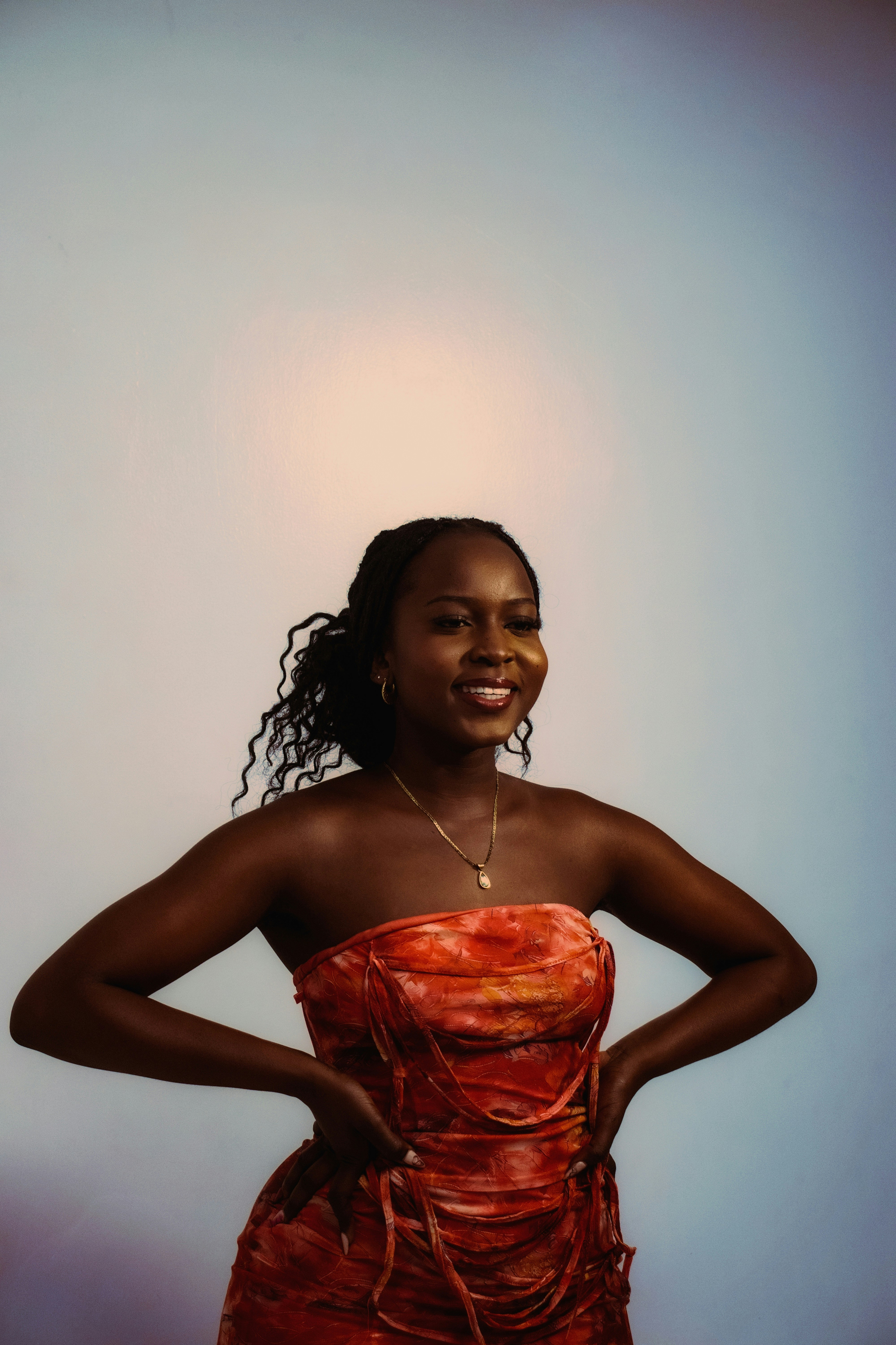 Grace in Color: Portrait of Confidence in Sunset Hues