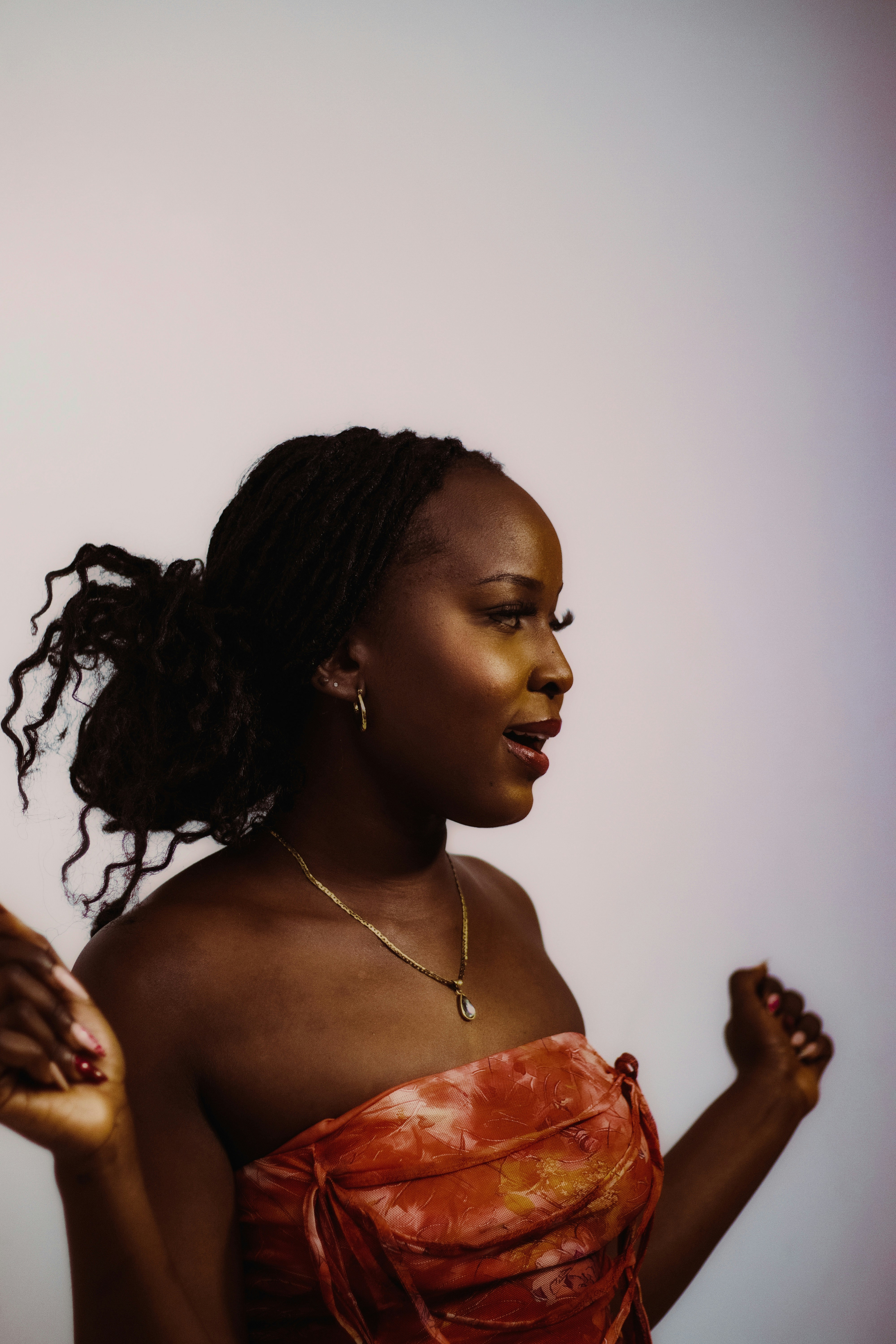 Graceful Spin: Ebony Portrait in Soft Light