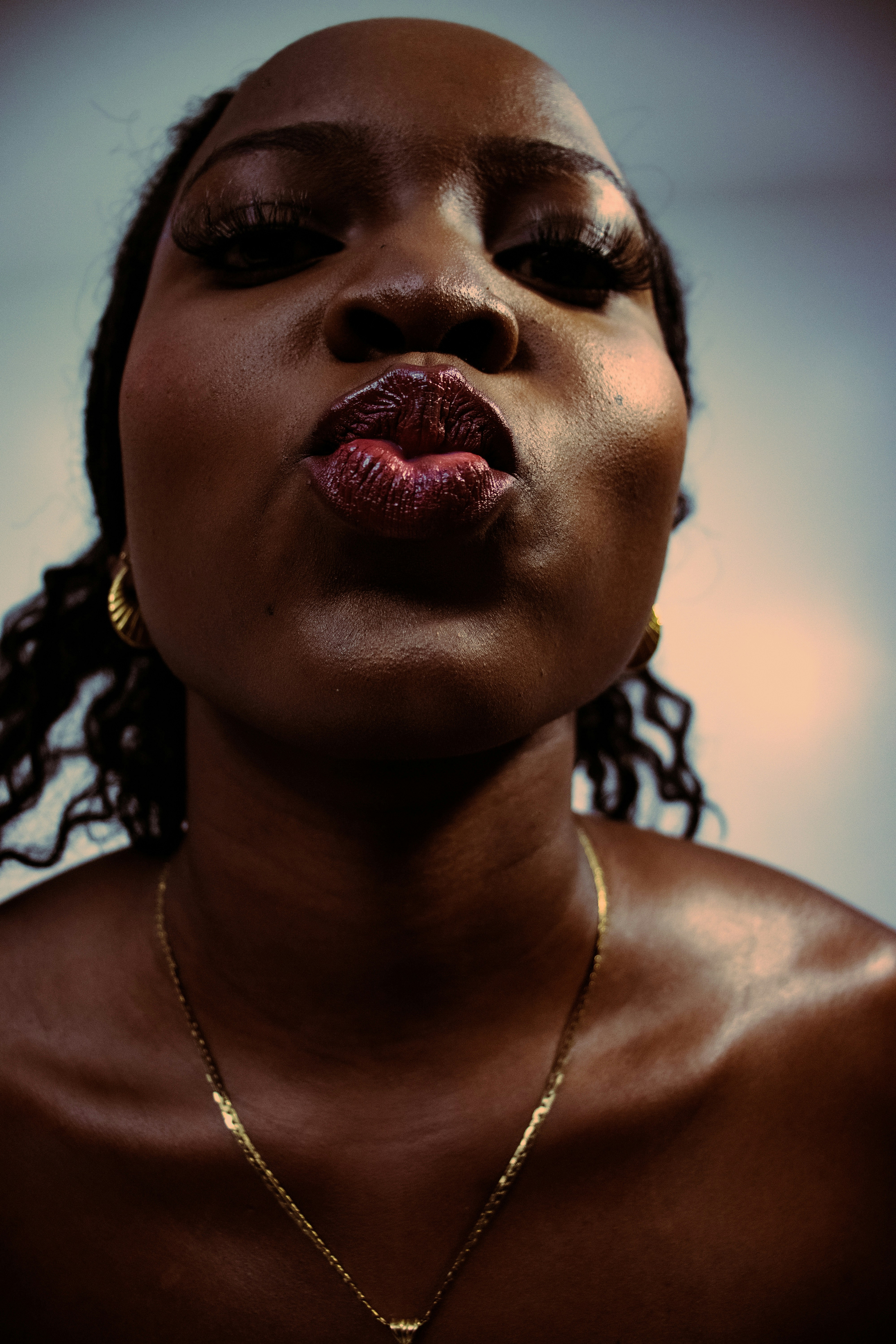 Close-Up Kiss: A Bold Portrait in Warm Neon Glow