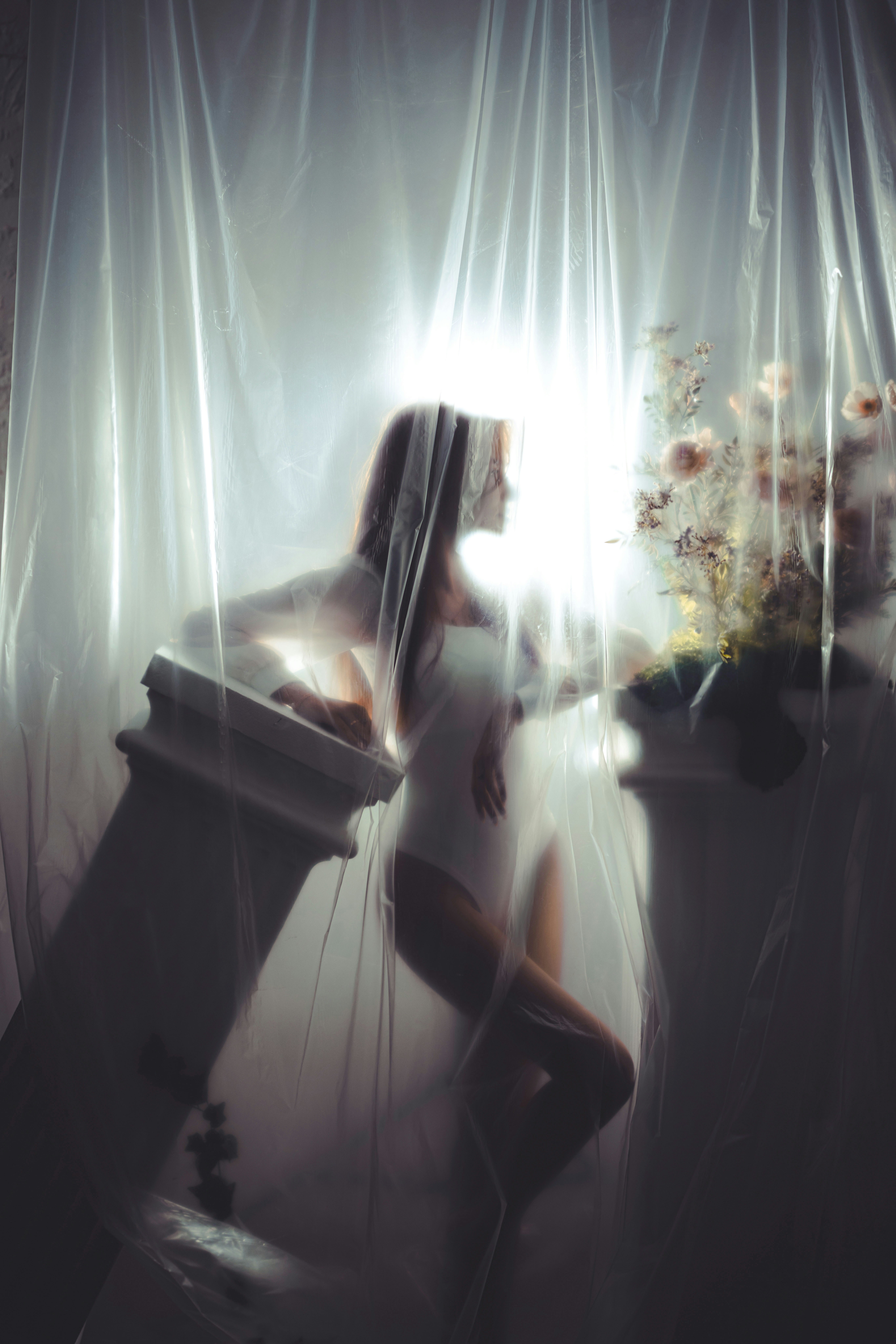 Veiled Bride in a Plastic Garden: Soft Focus Portrait Through Sheer MRI-Glass Curtains
