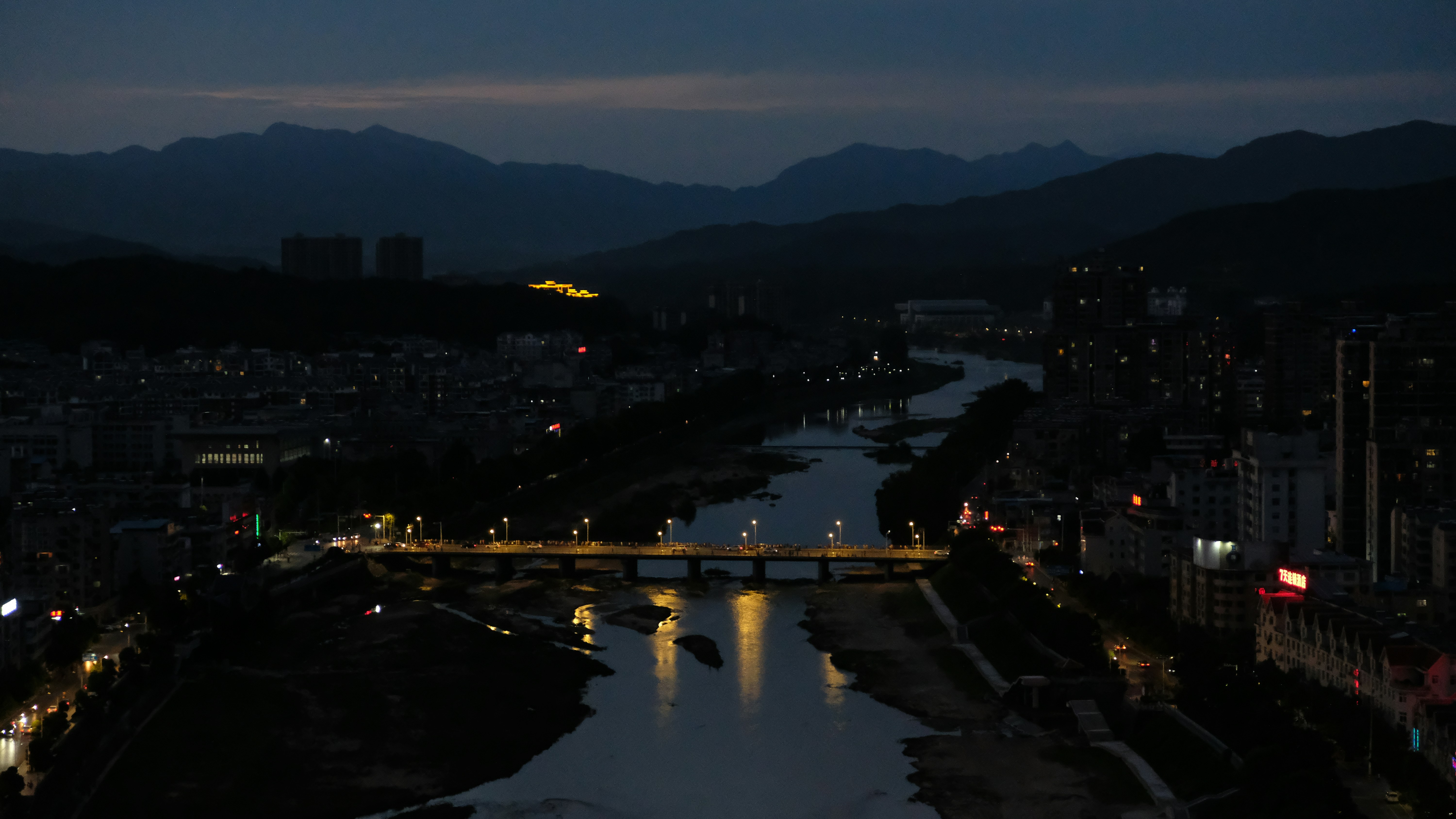 Moonlit Riverway: Bridges and City Lights in Quiet Dusk