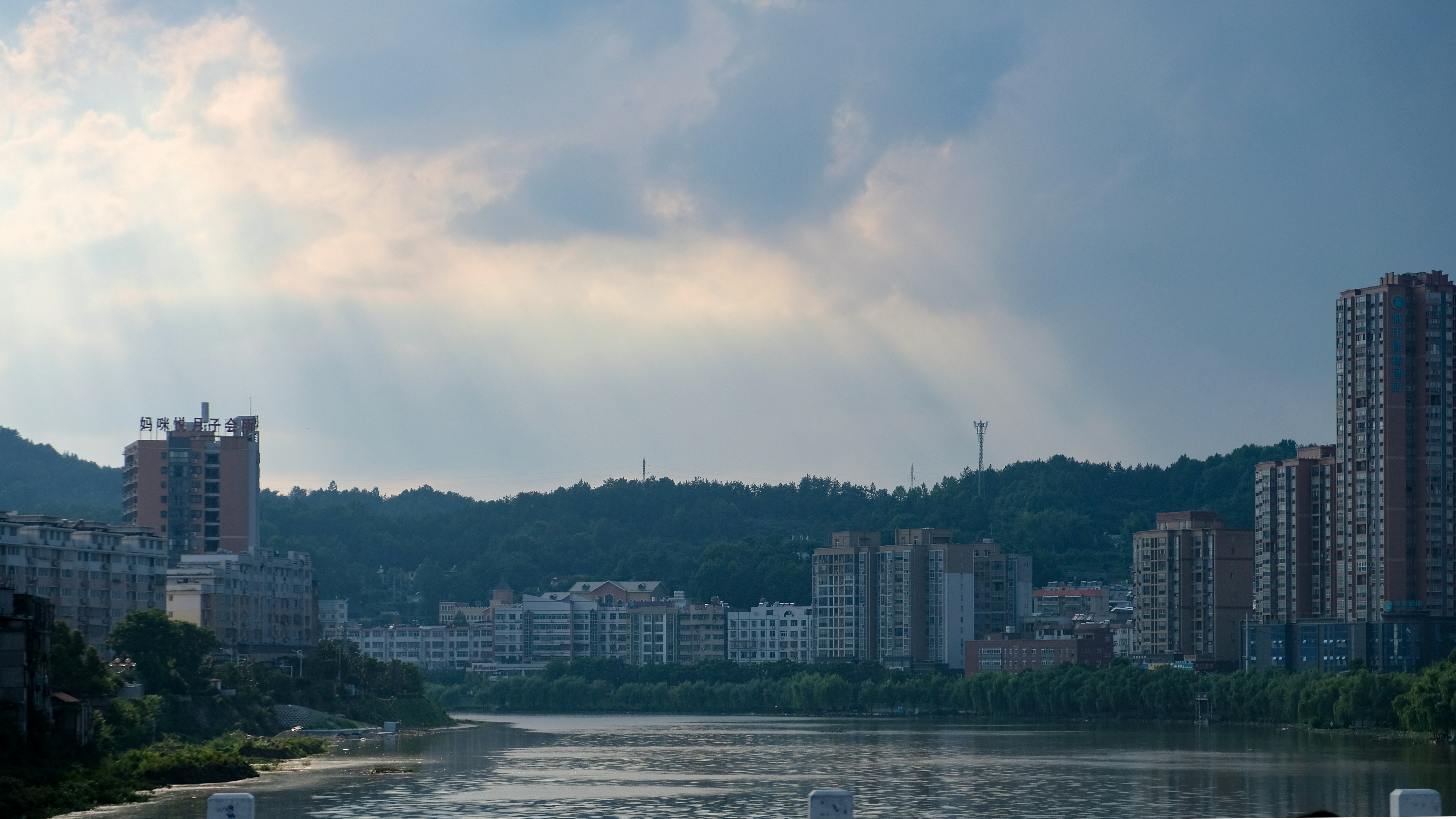 Riverside Skyline: Morning Light Over the City
