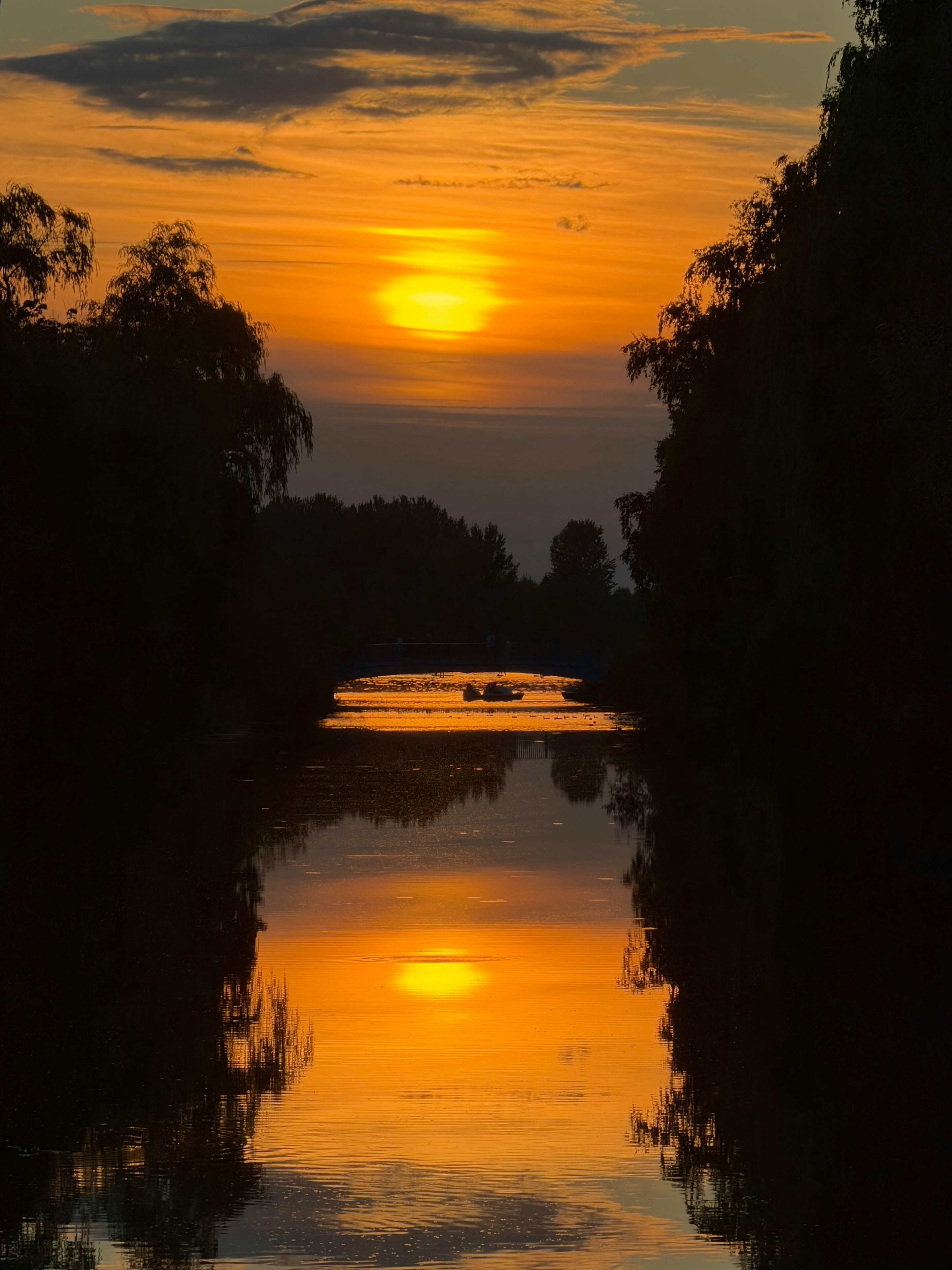 Sunlit Path of Silence: A Canal at Dusk