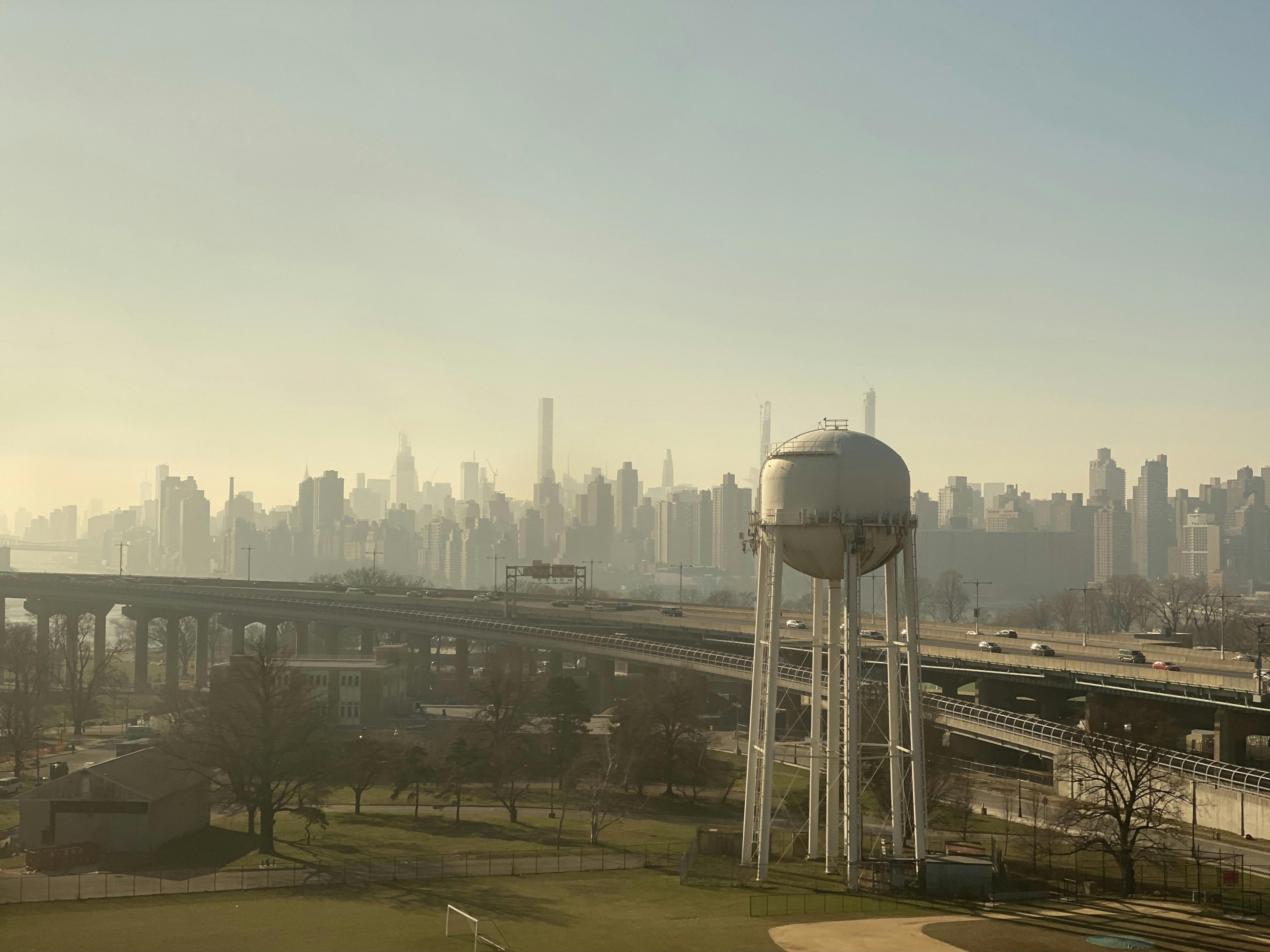 Industrial Skyline Beyond a Deserted Water Tank