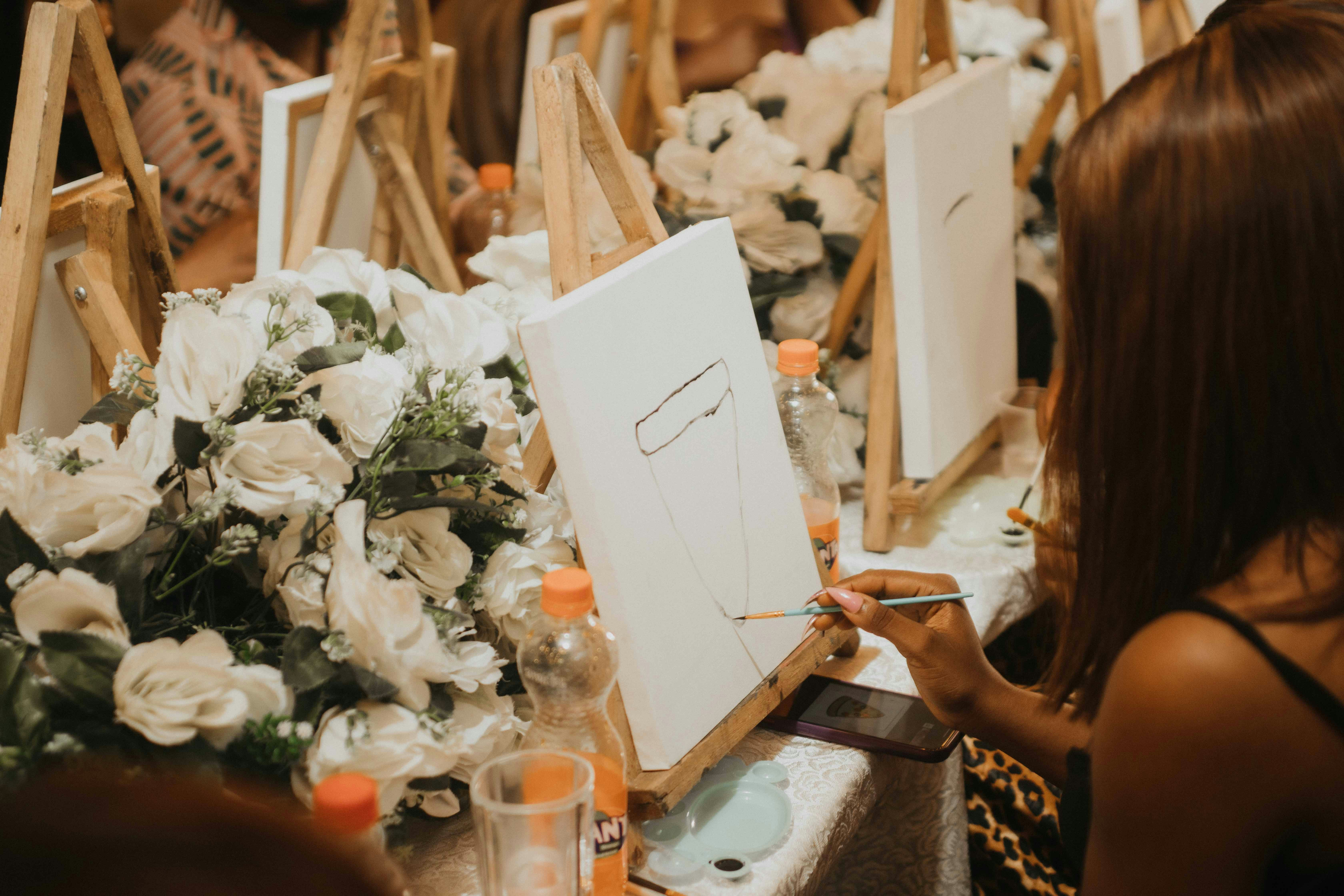 Brushstrokes of Focus: A Hands-On Portrait Session at the Floral Easels