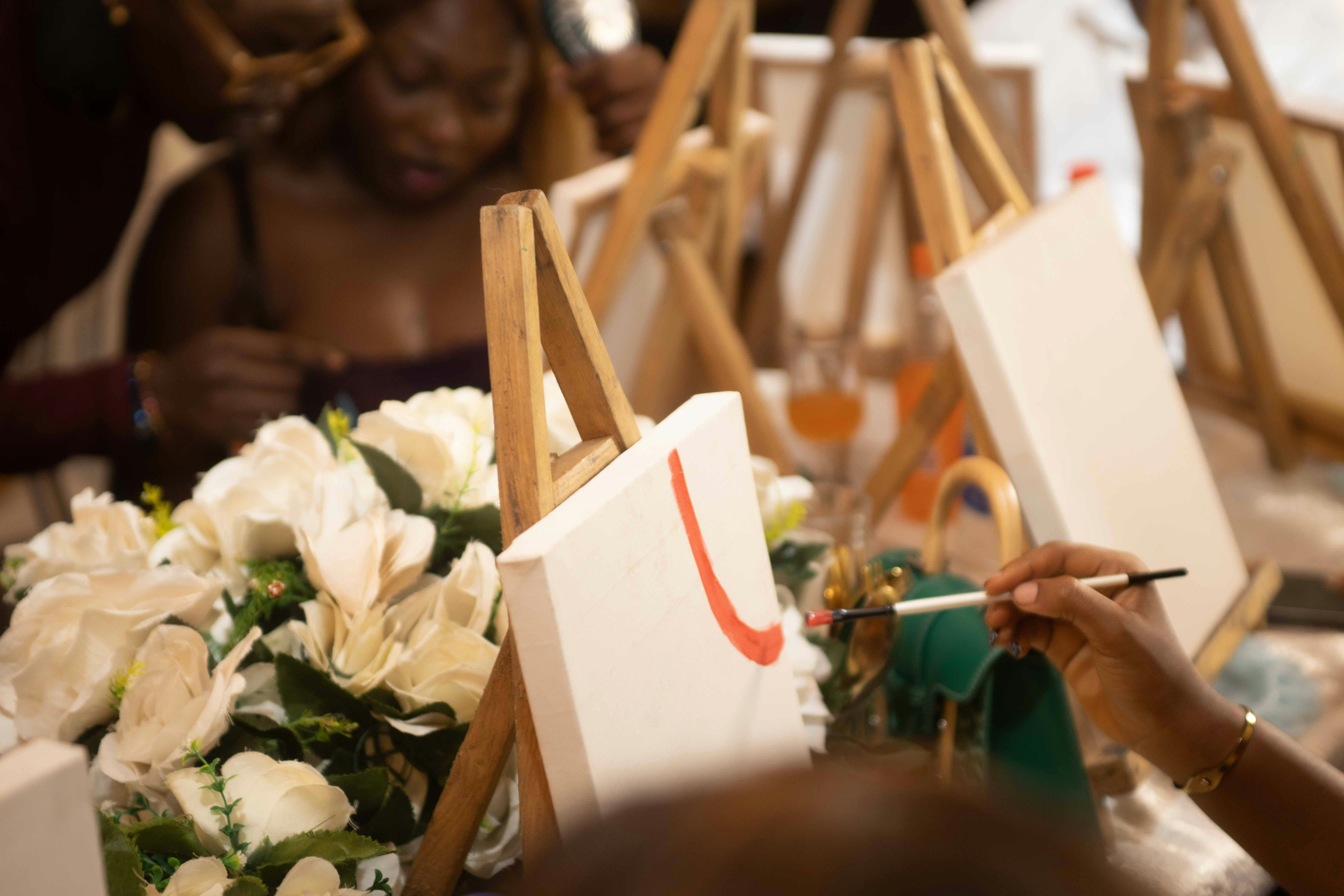 Canvas in Bloom: A Painting Demonstration Amid White Roses