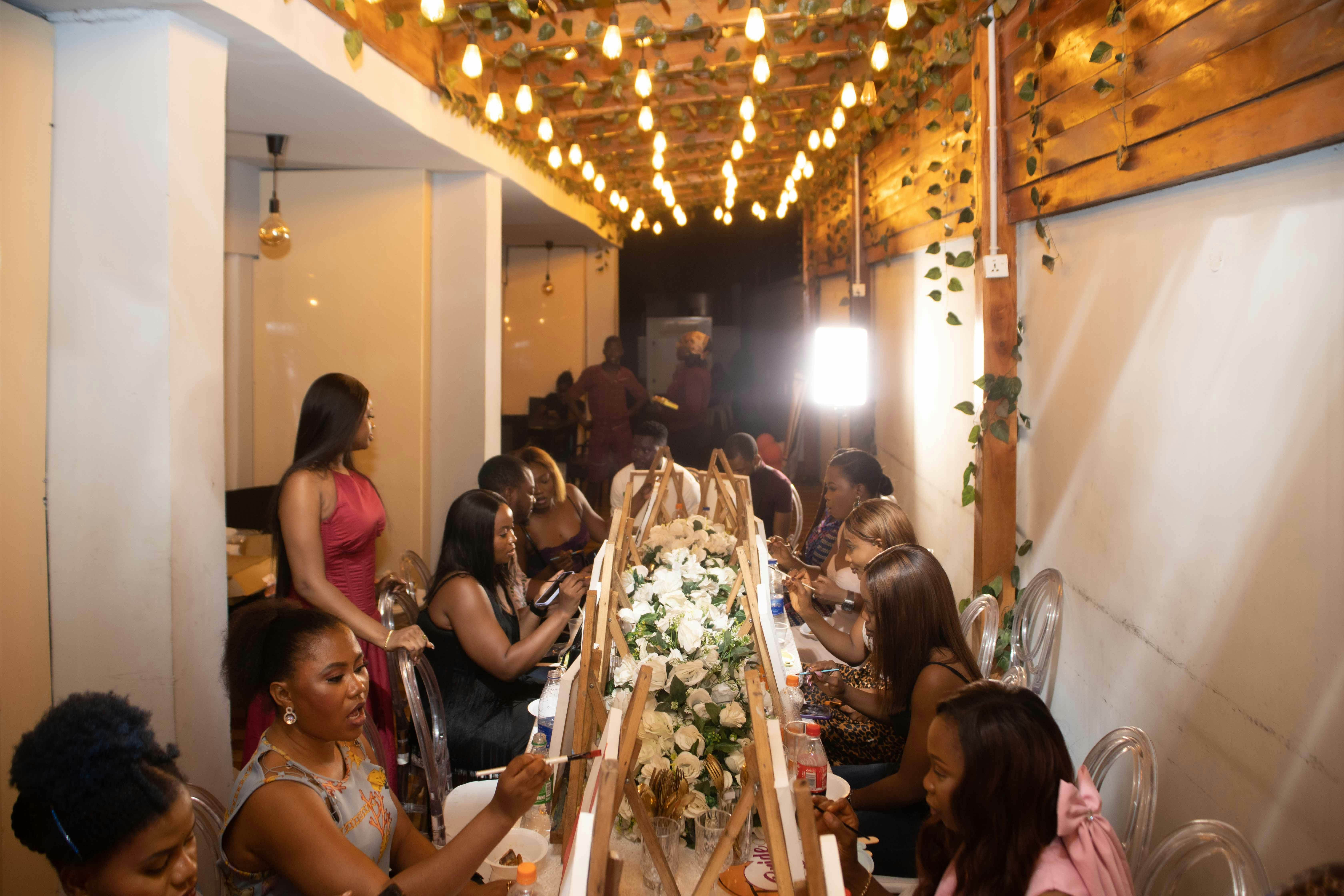Ambient Reception: Guests Gather for a Floral Centerpiece Dinner