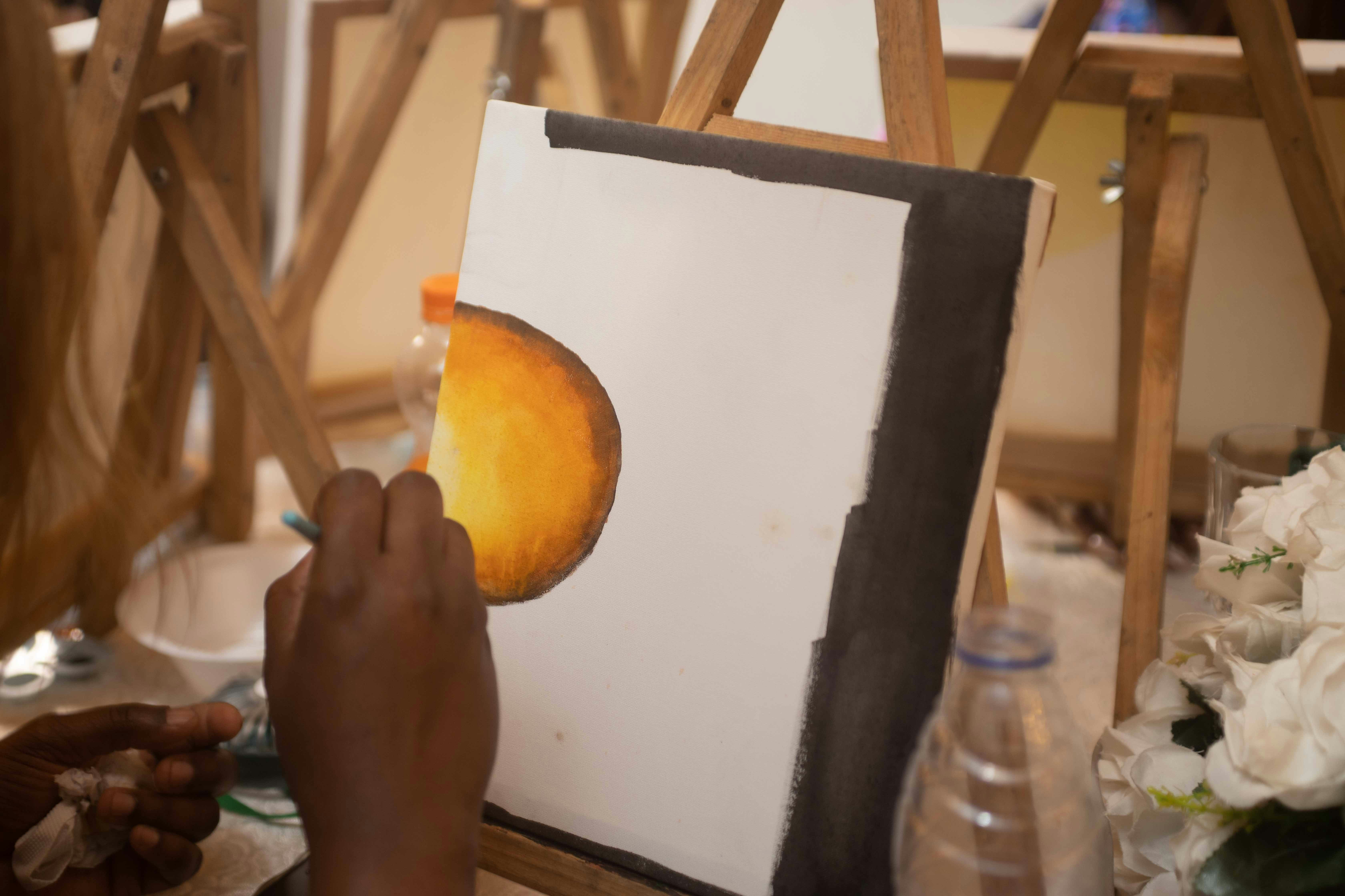 Brushstrokes in Focus: An Artist’s Moment with a Golden Crescent