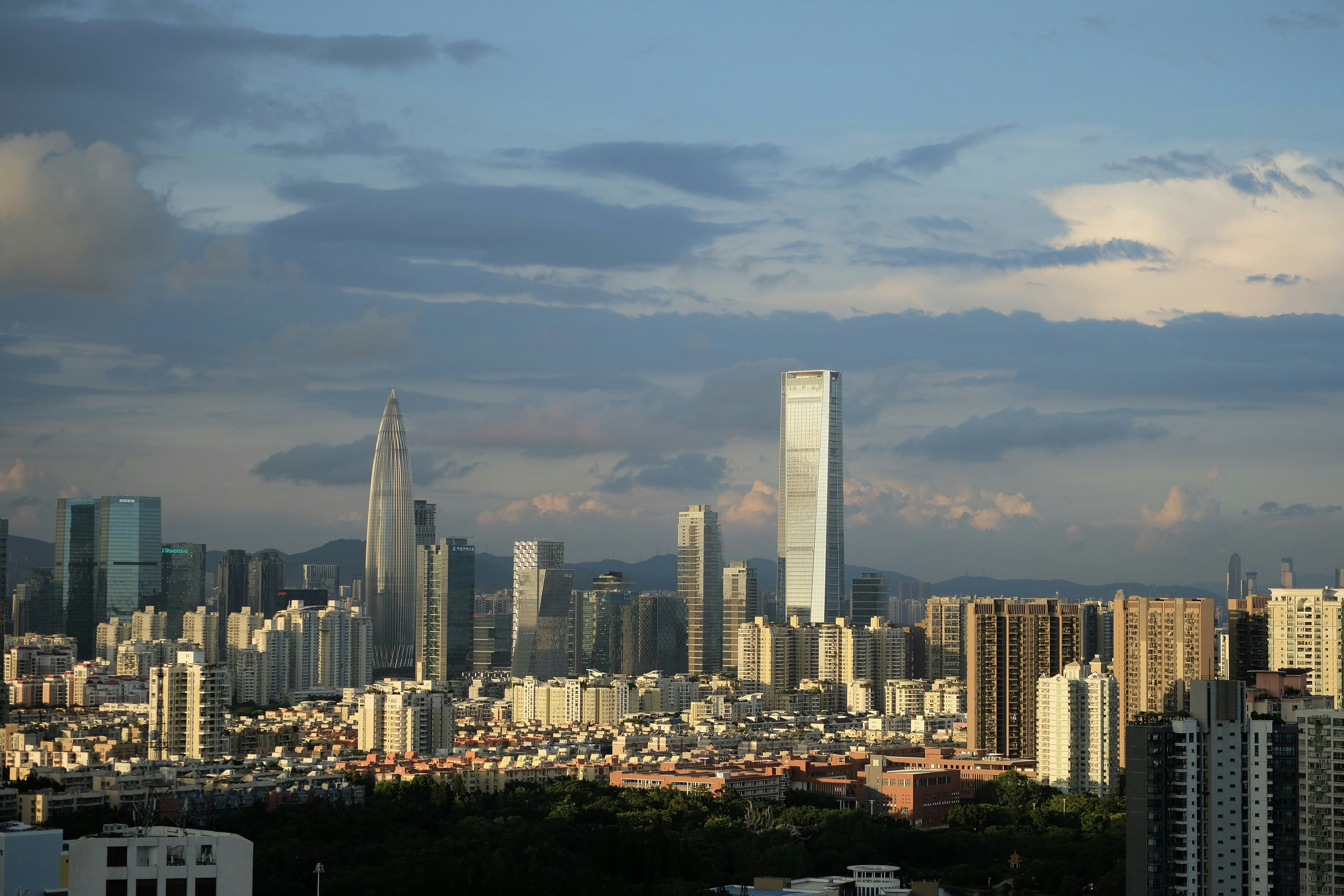 Skyline Sentinel: A City Awakens Under Soft Alpenglow