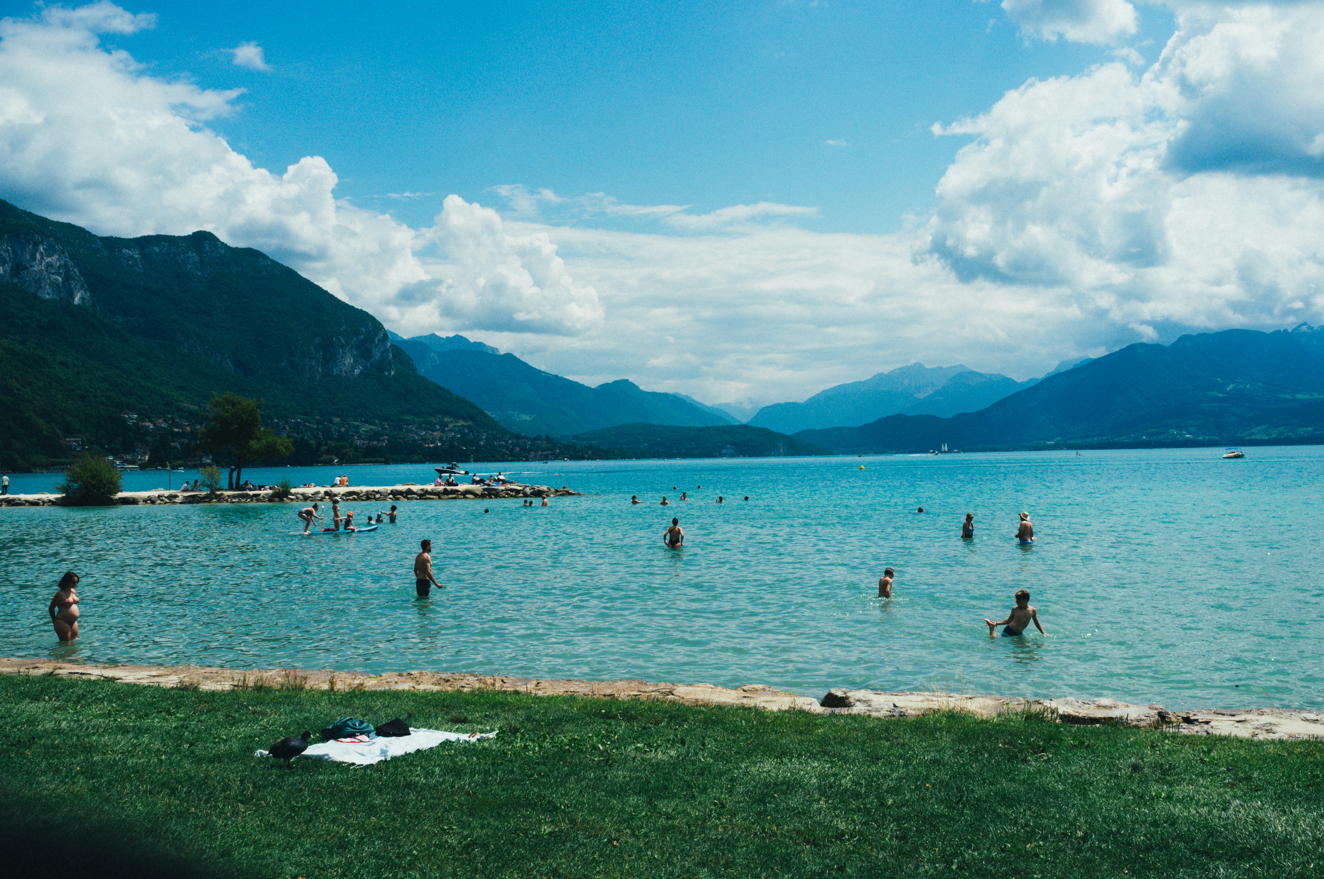 Turquoise Lake and Peaks: Sunlit Leisure by the Alpine Shore