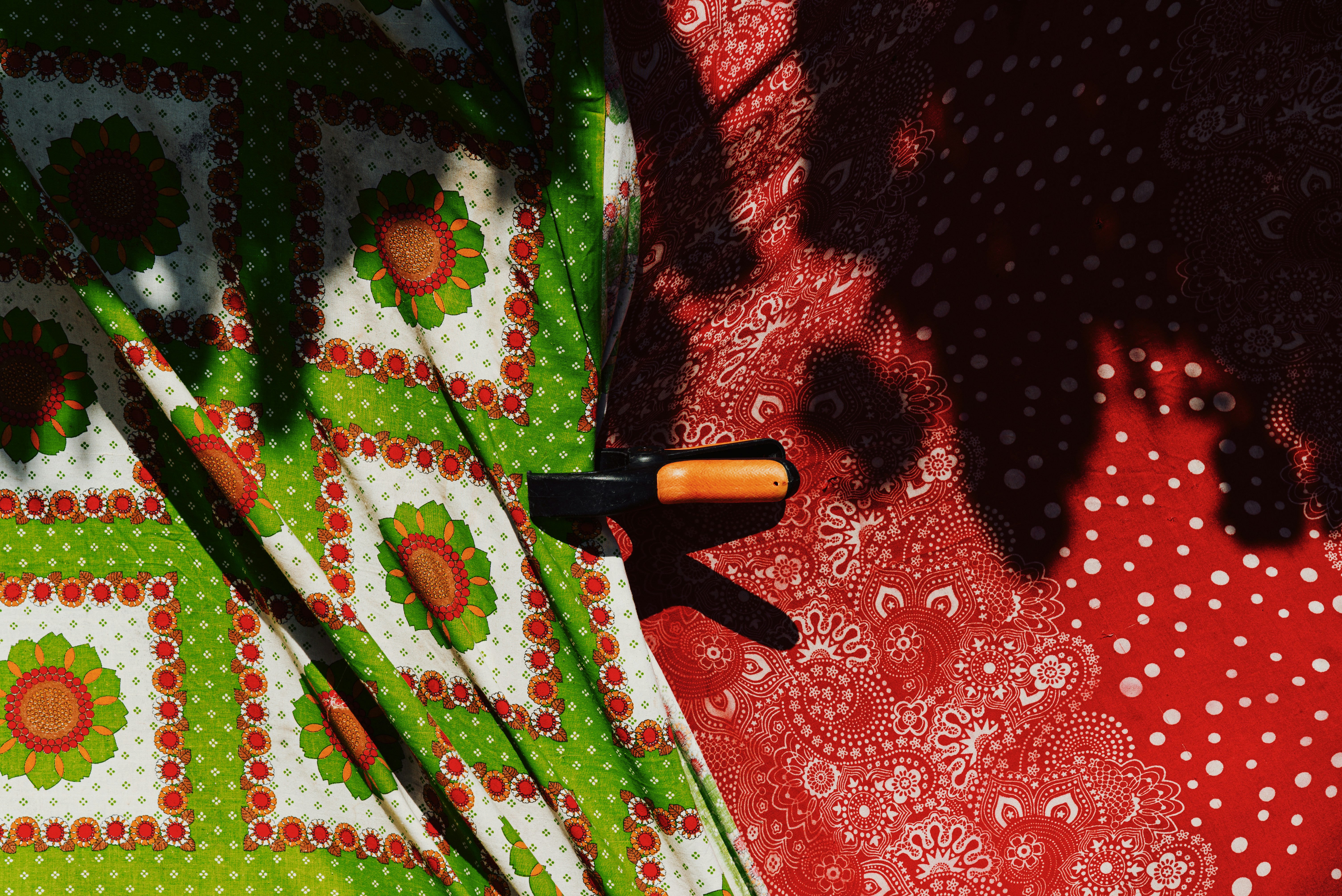 Needle in the Patchwork: A Sunlit Moment on Fabric and Shadow