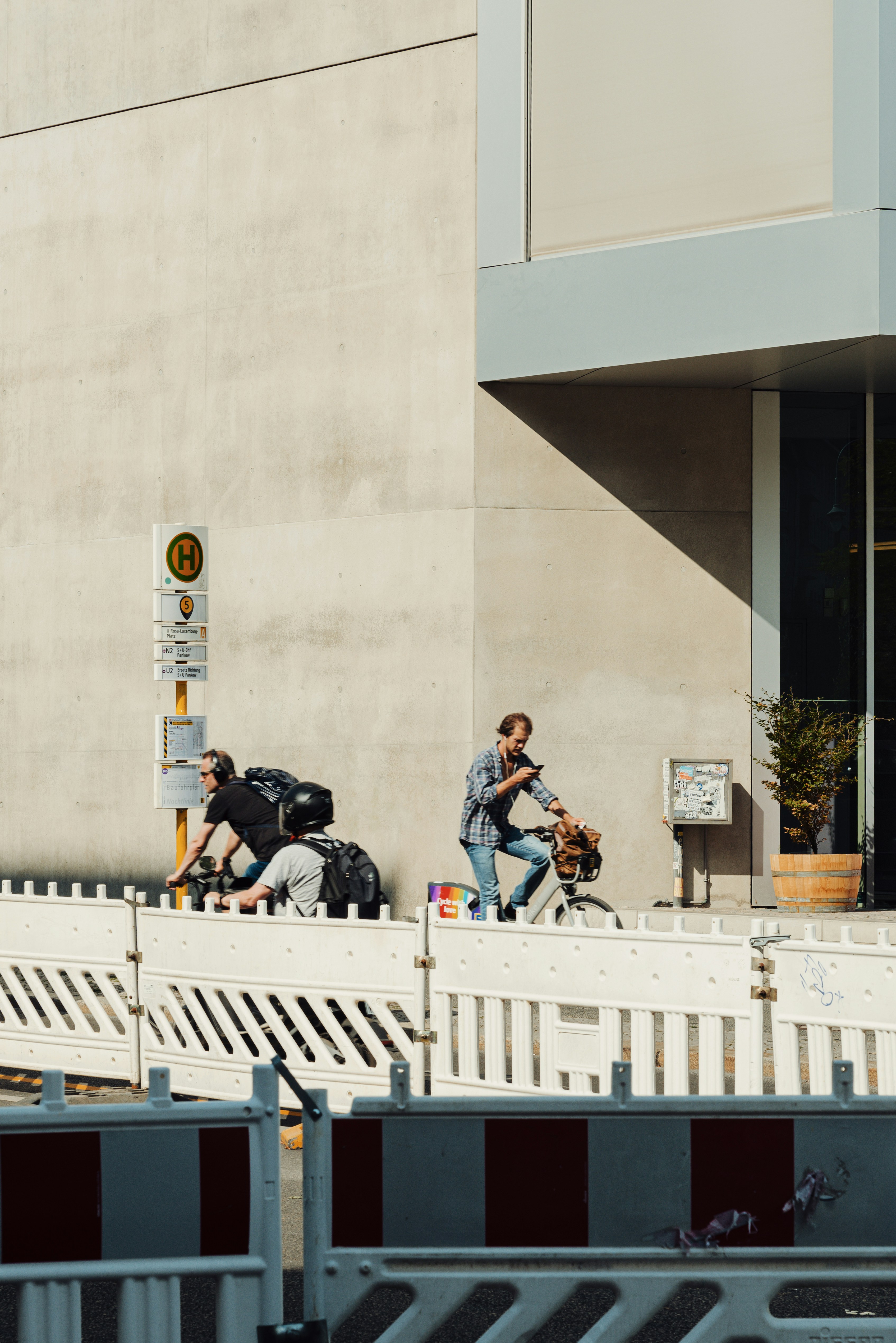 Urban Riders: A City Pedal Past the Concrete Wall