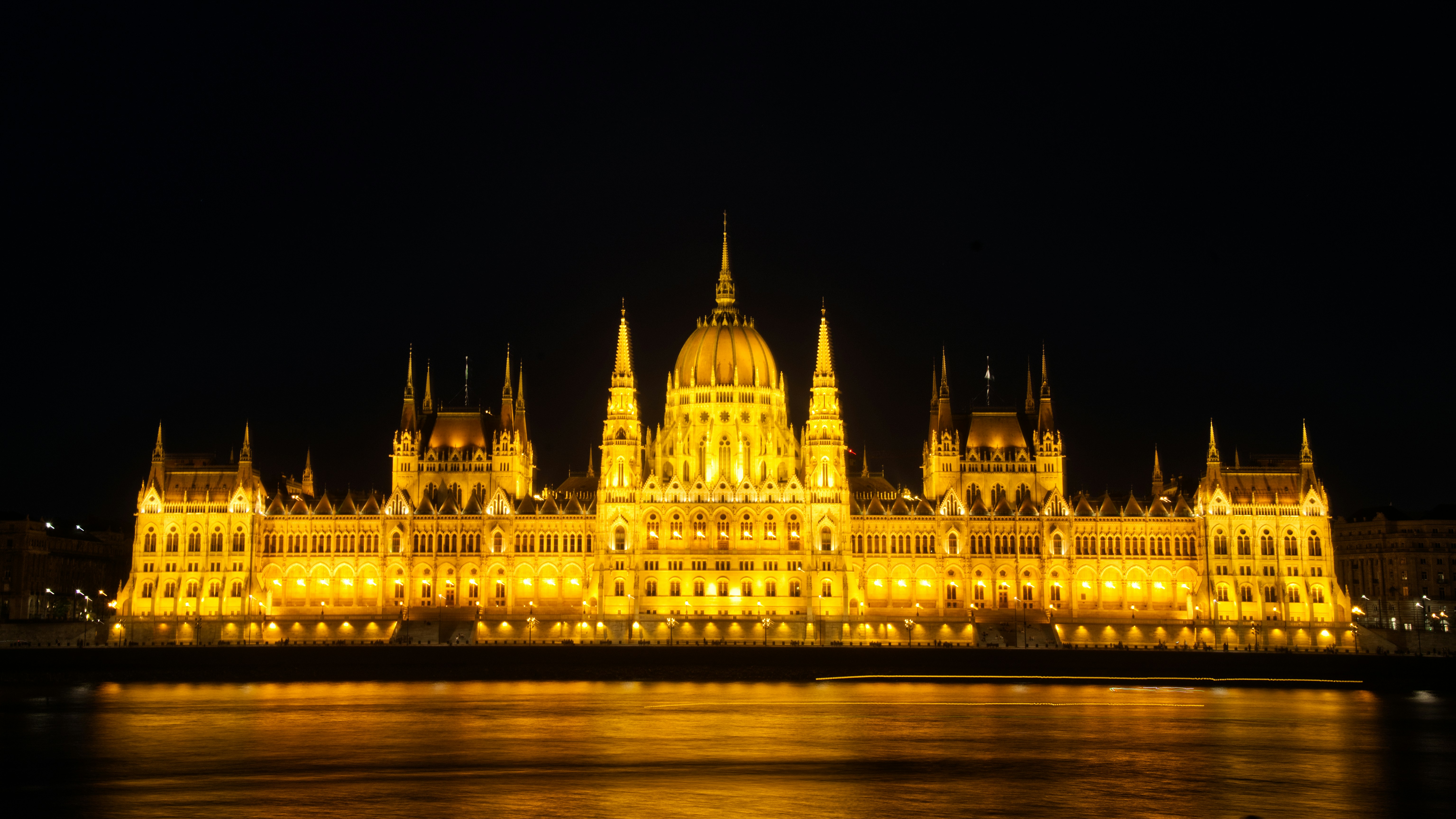 Golden Night: The Hungarian Parliament Illuminated Across the Danube