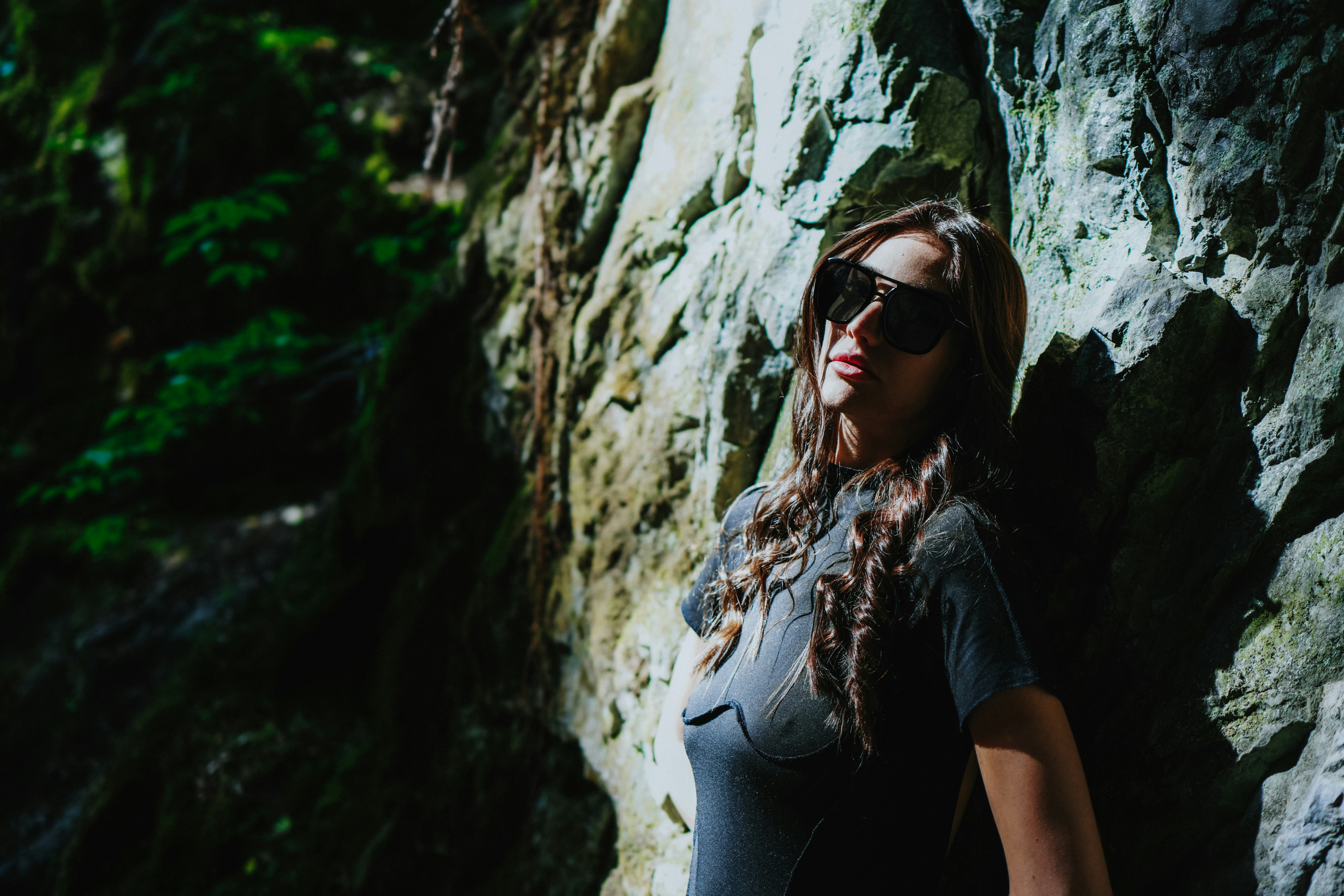 Shadowed Rockside Portrait in Dappled Green Light