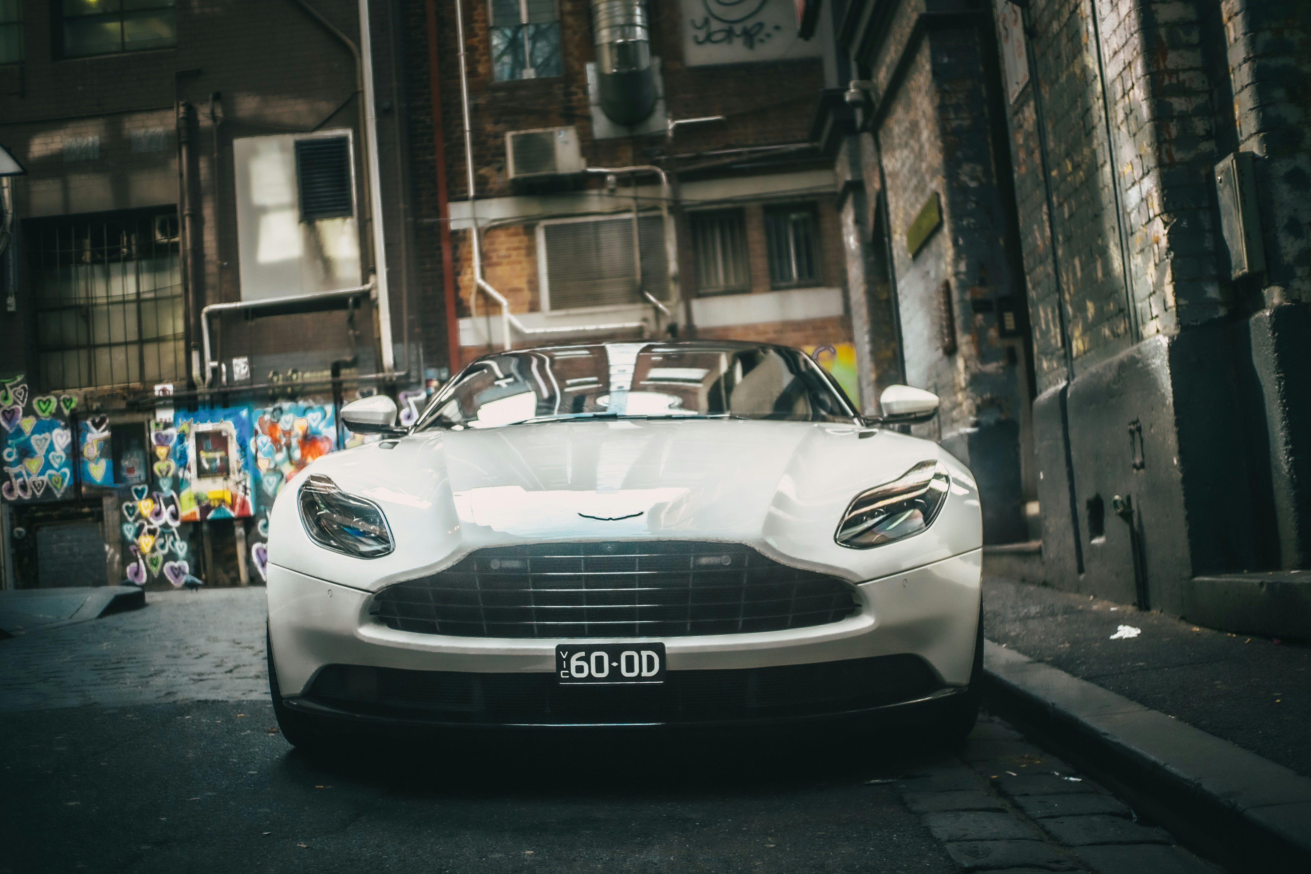 Low-Angle Gaze: The White Convertible in an Urban Alley