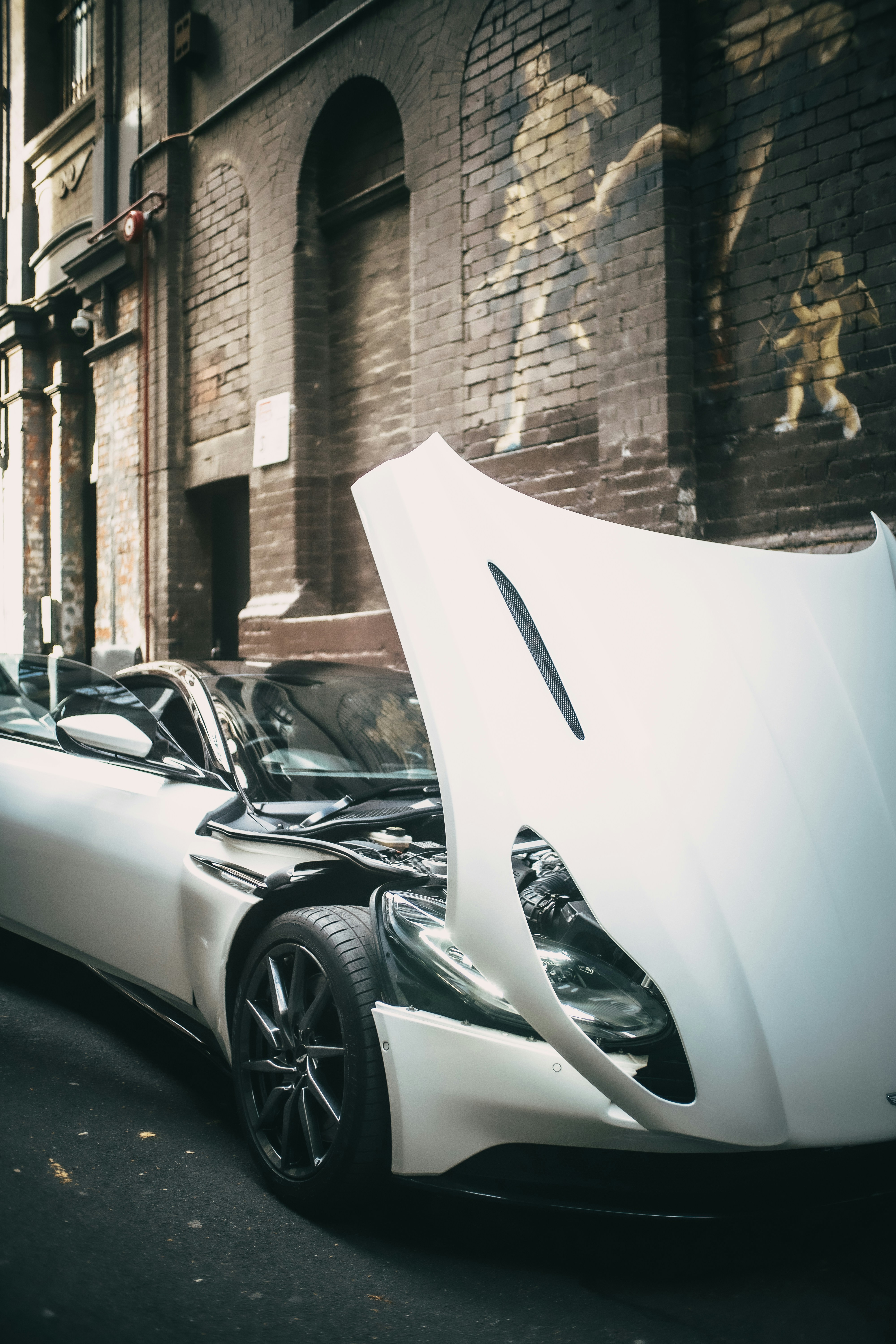 Under the Hood: Street Scene with a Shining Supercar