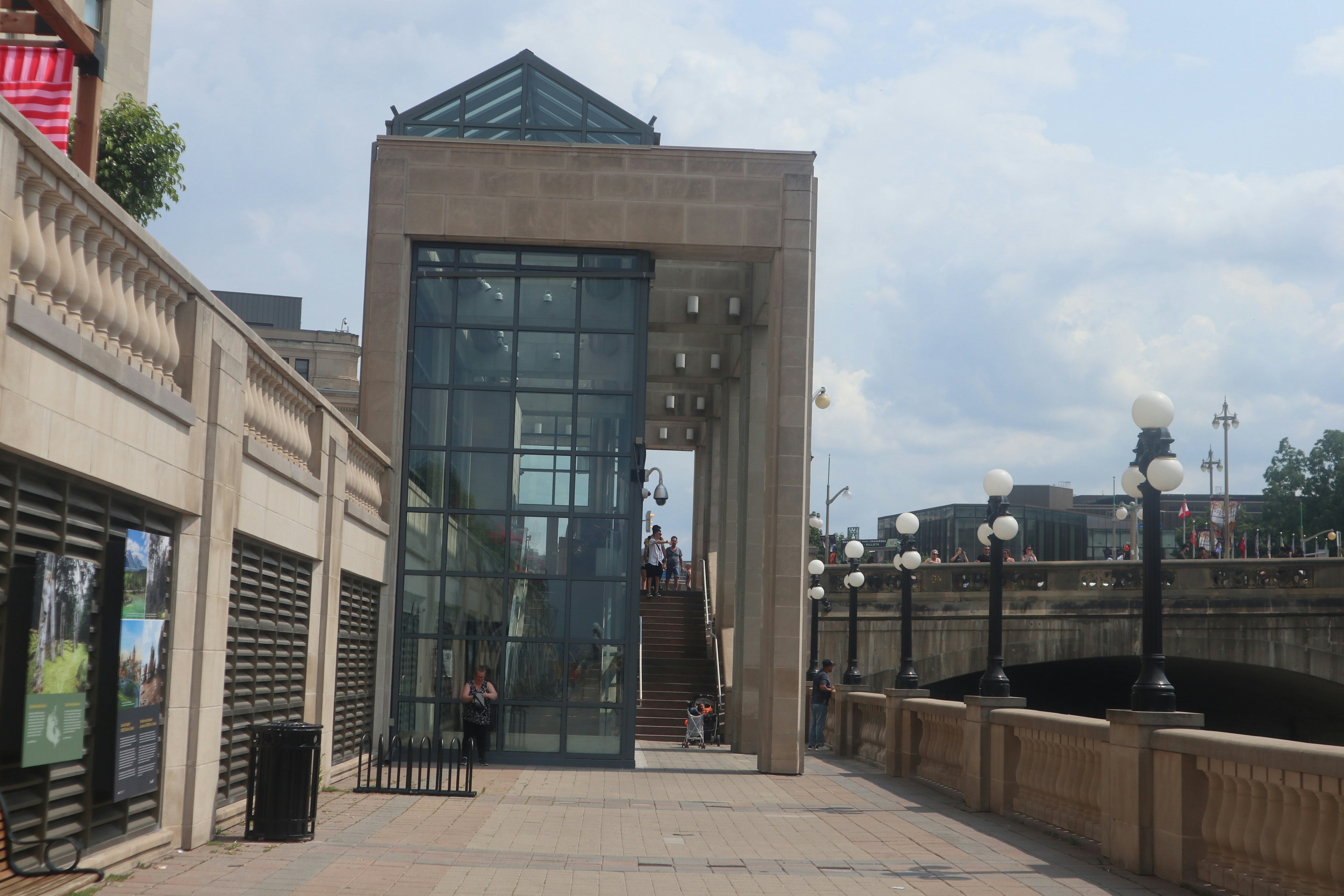 Glass Atrium Awakens: A Sunlit Path to the Riverside Staircase