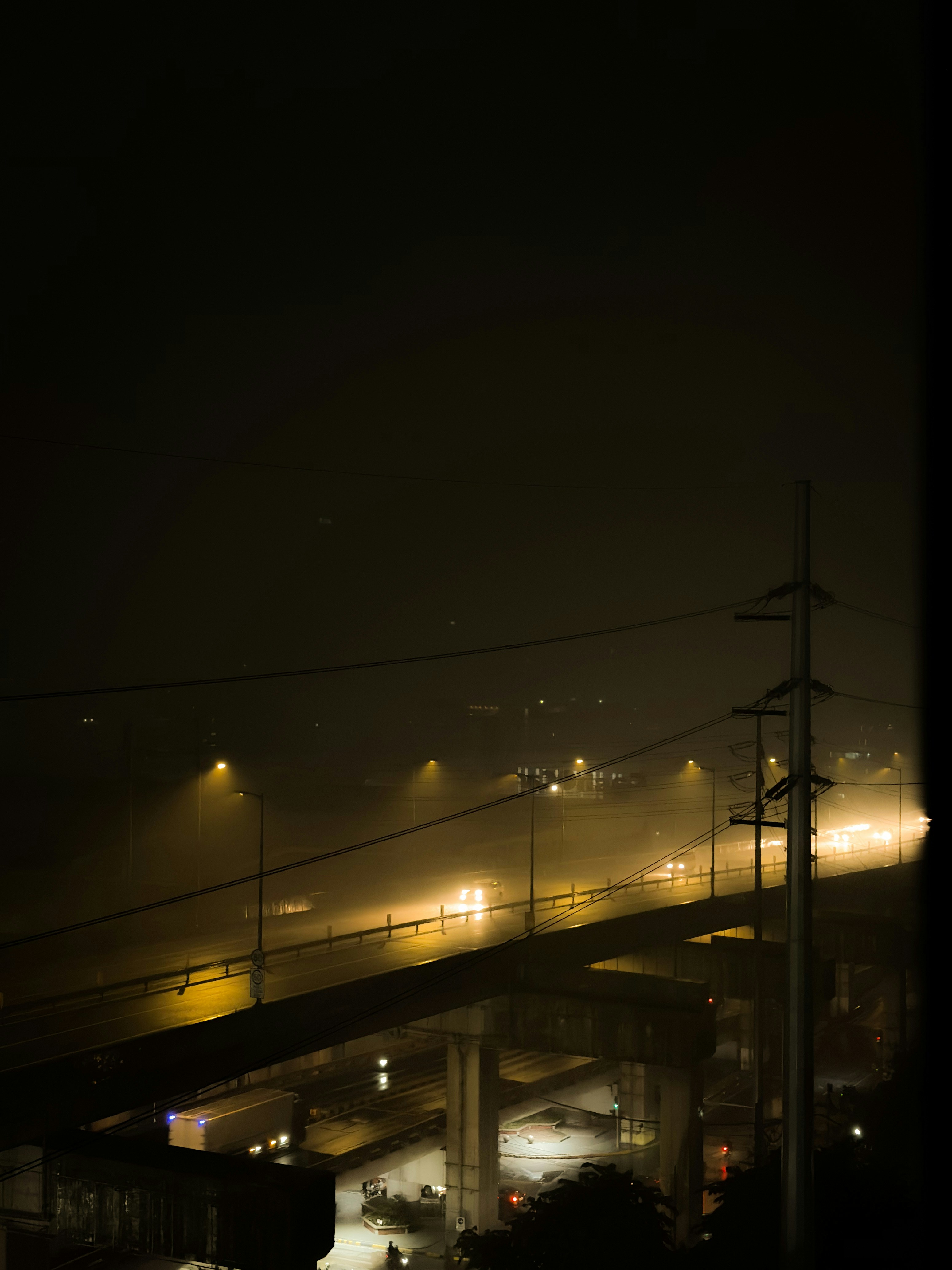 Nightbound Along the Fogged Overpass