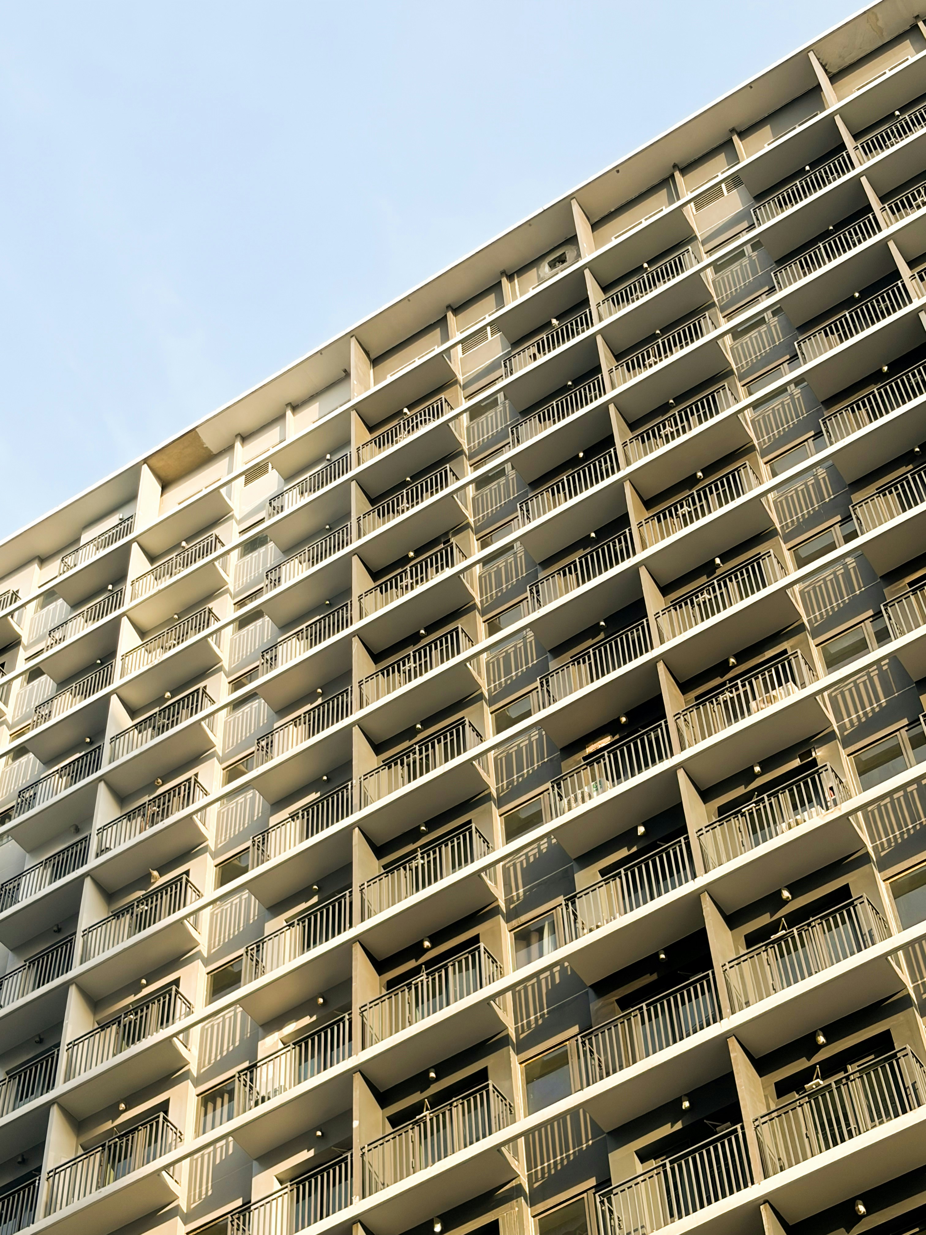 Diagonal Facade: A Grid of Balconies Reaching for the Sky