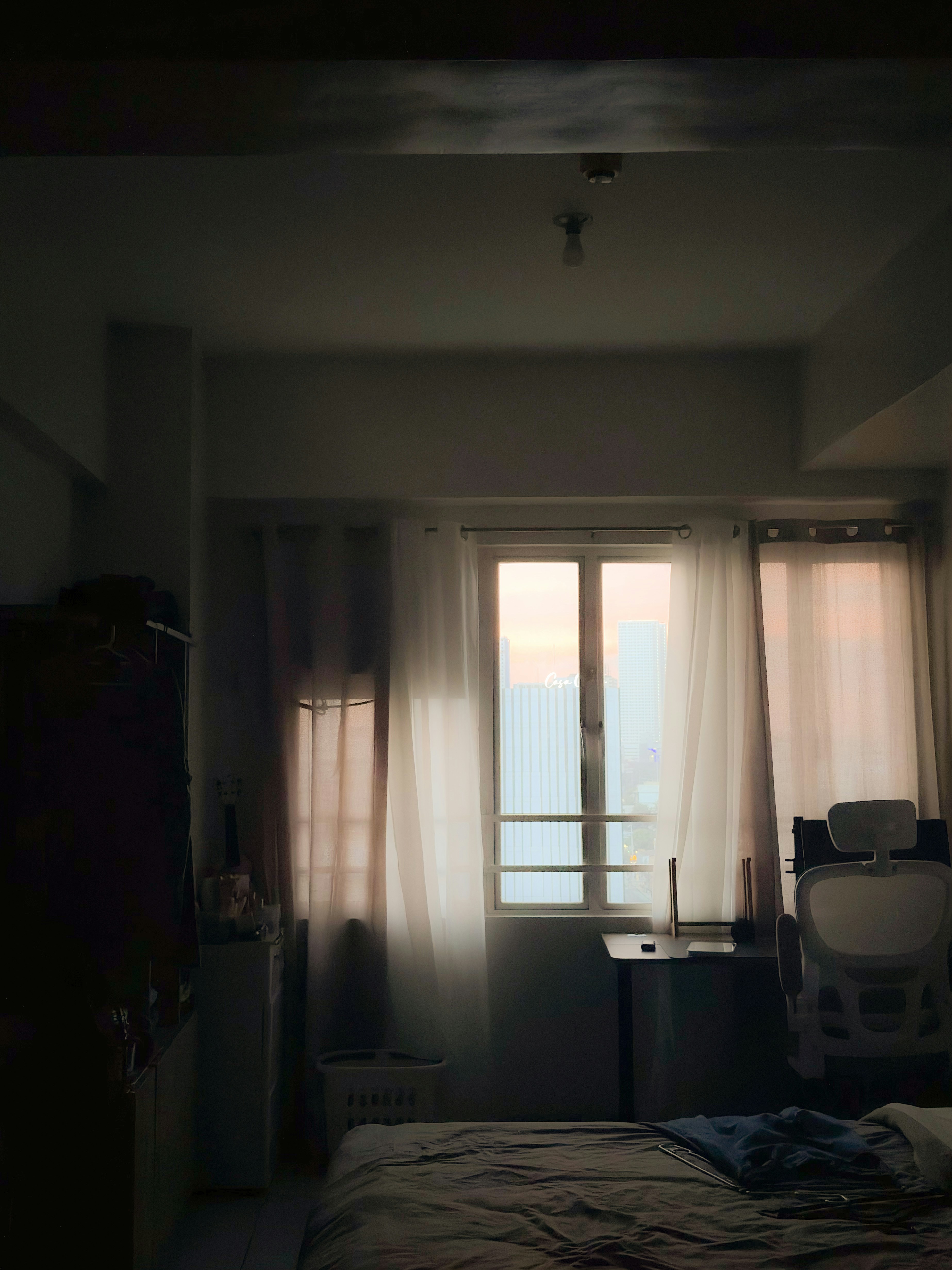 A Quiet City View Through Sheer Drapes