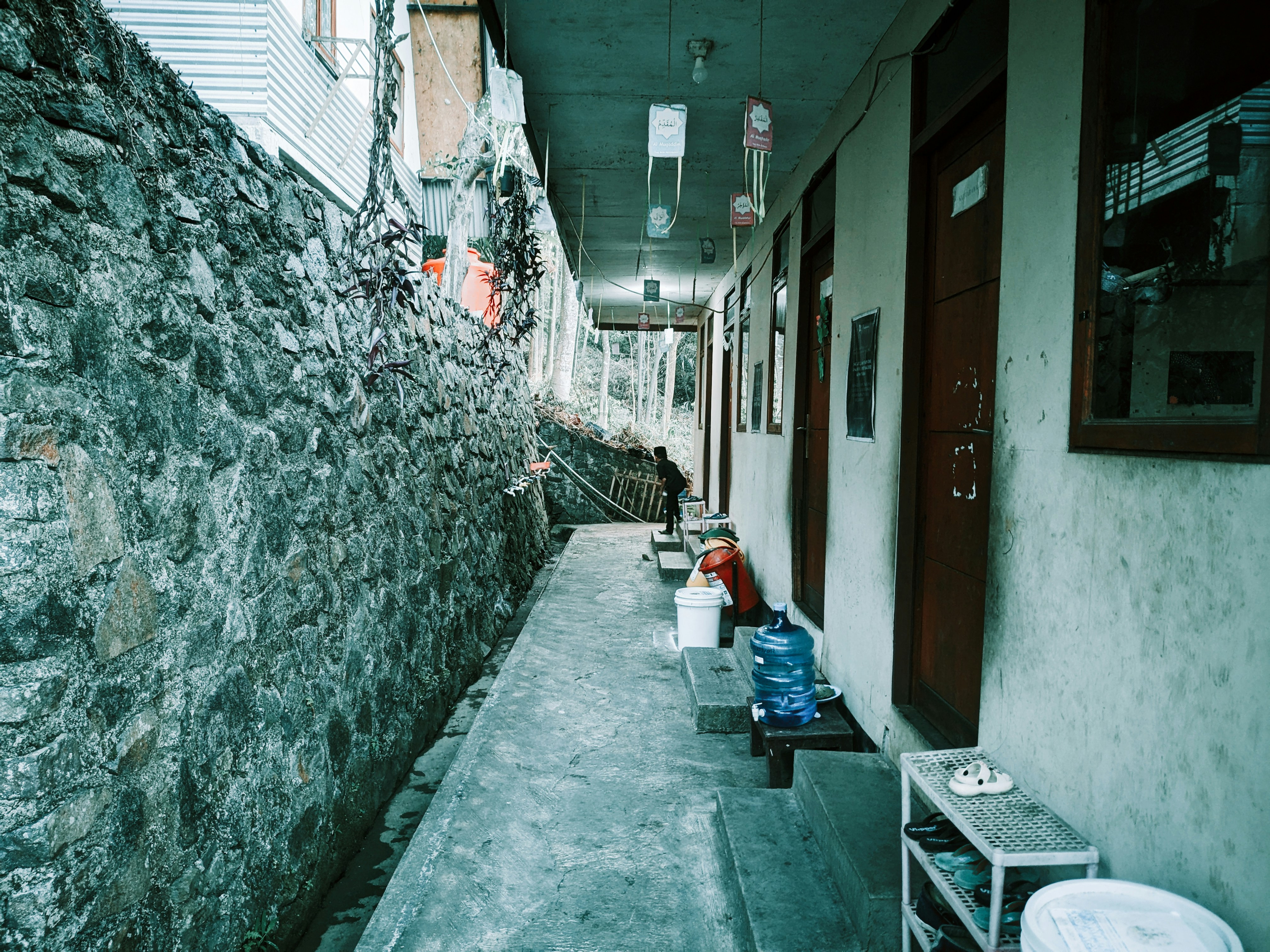 Narrow Alleyway Corridor Between Weathered Walls