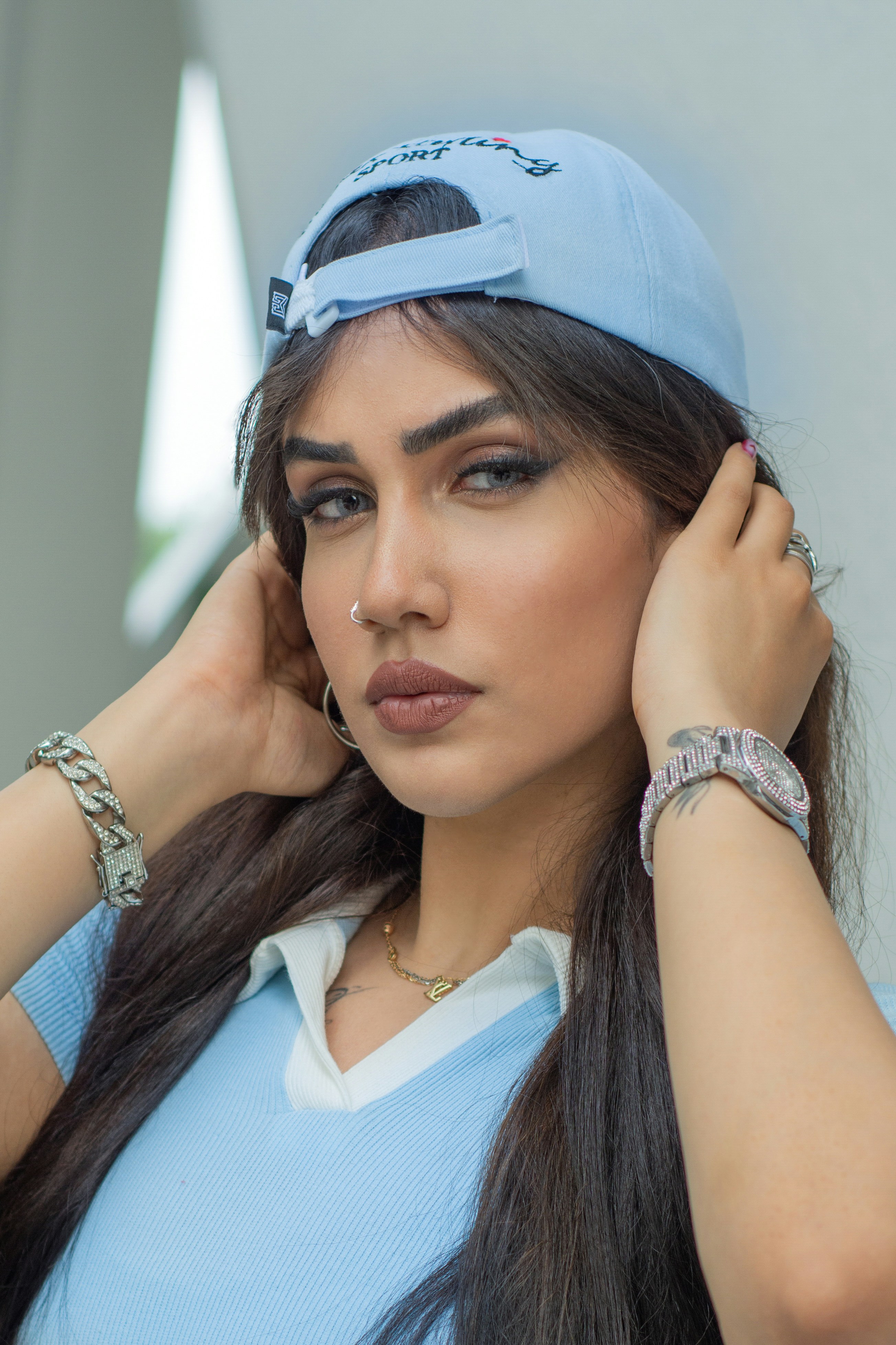 Capsule of Confidence: A Portrait in Blue Caps and Soft Light