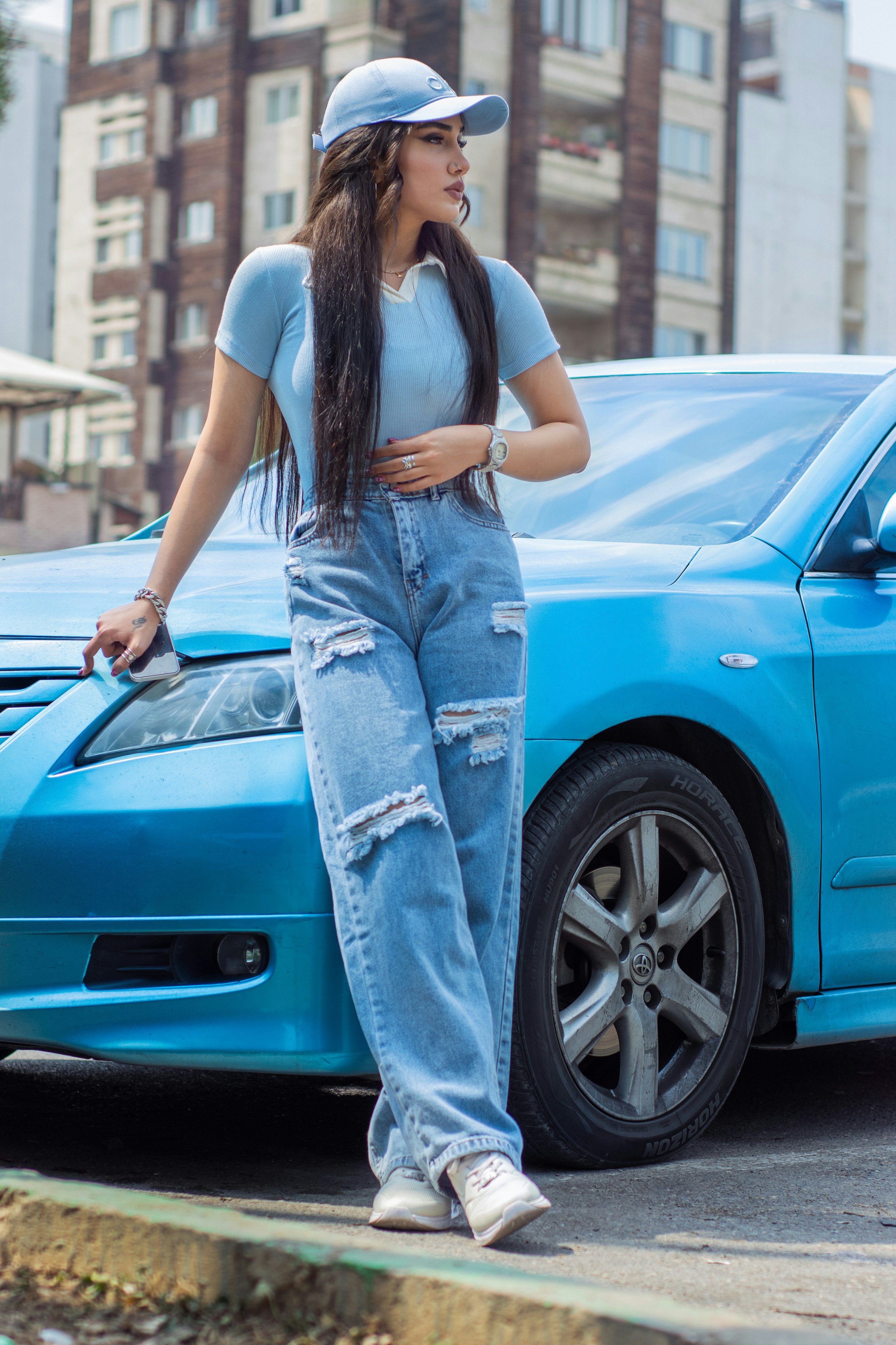 Blue-jean Alley Icon: A Casual Portrait by the Car