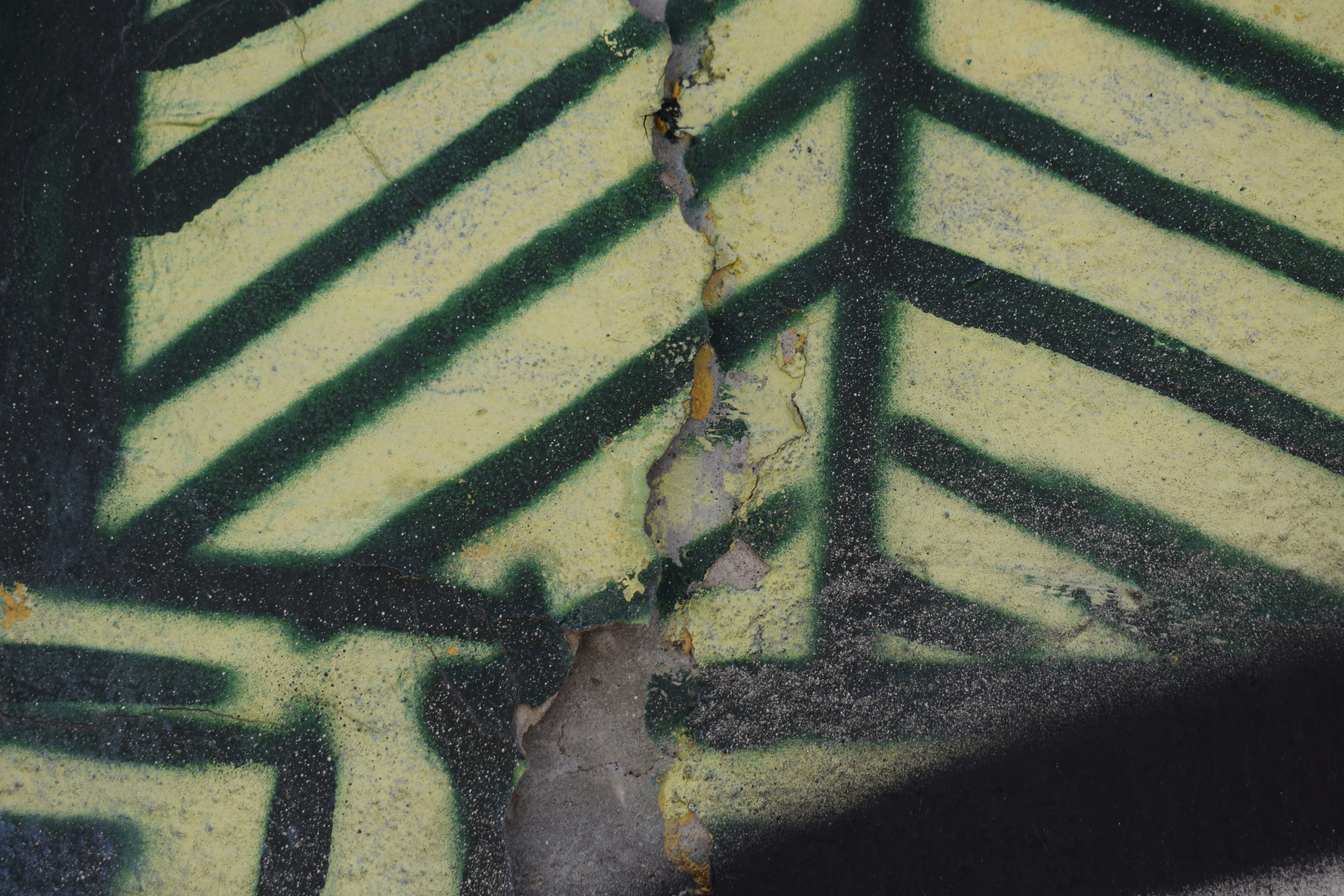 Cracked Glyph: Fractured Graffiti Under a Veil of Light