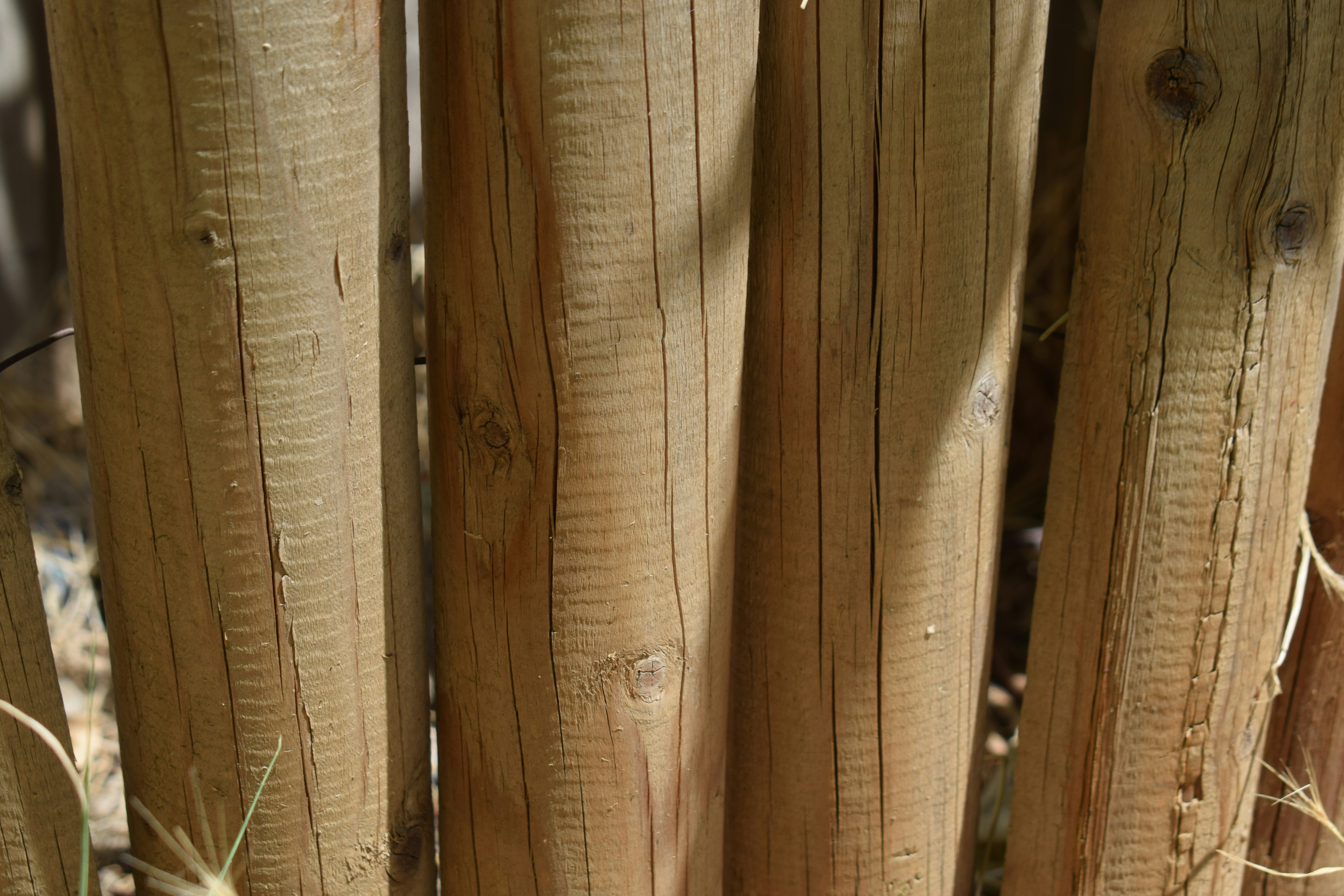 Stacked Carved Pines: Vertical Cedar Columns Close-Up