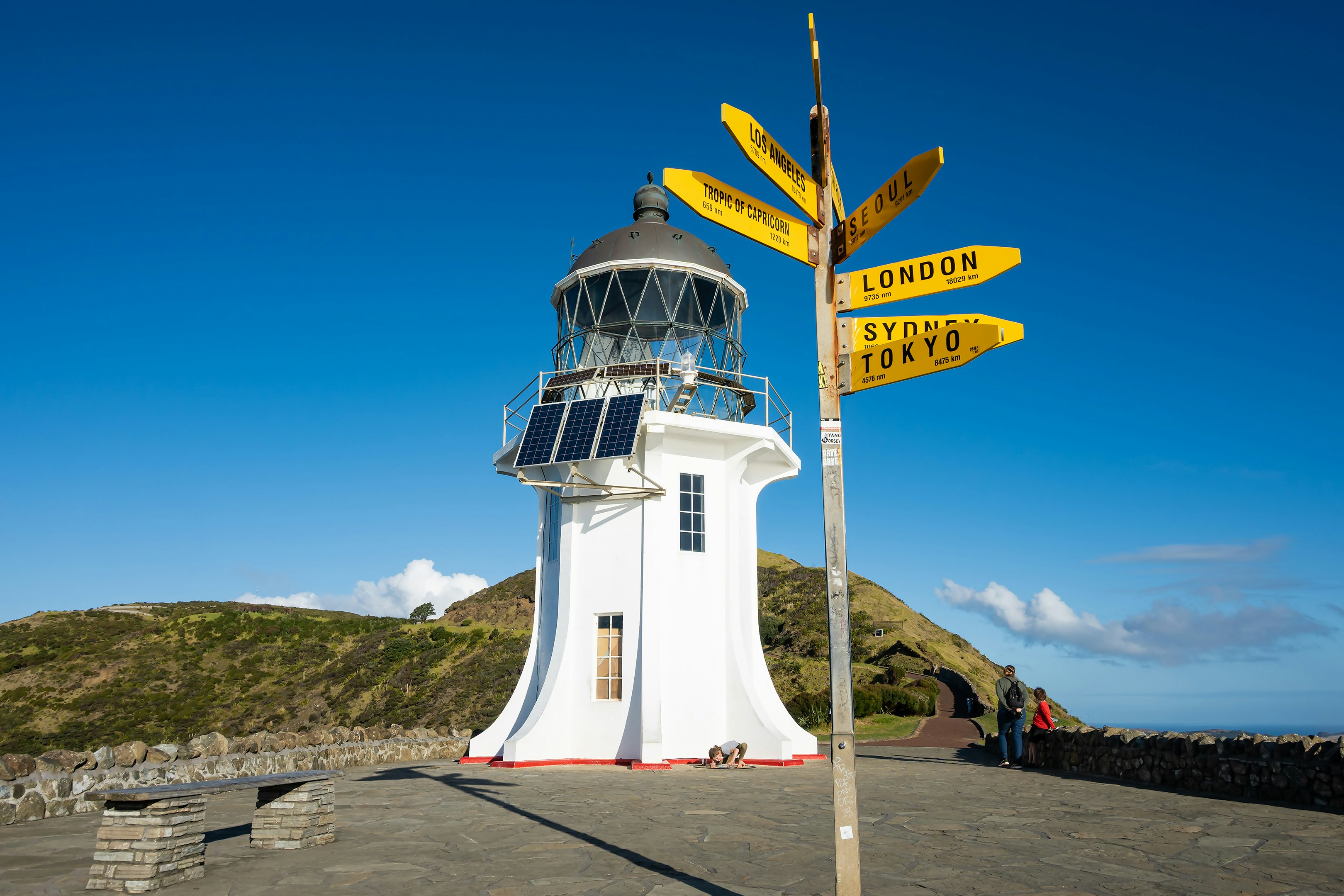 Sunlit Lighthouse at a Coastal Crossing