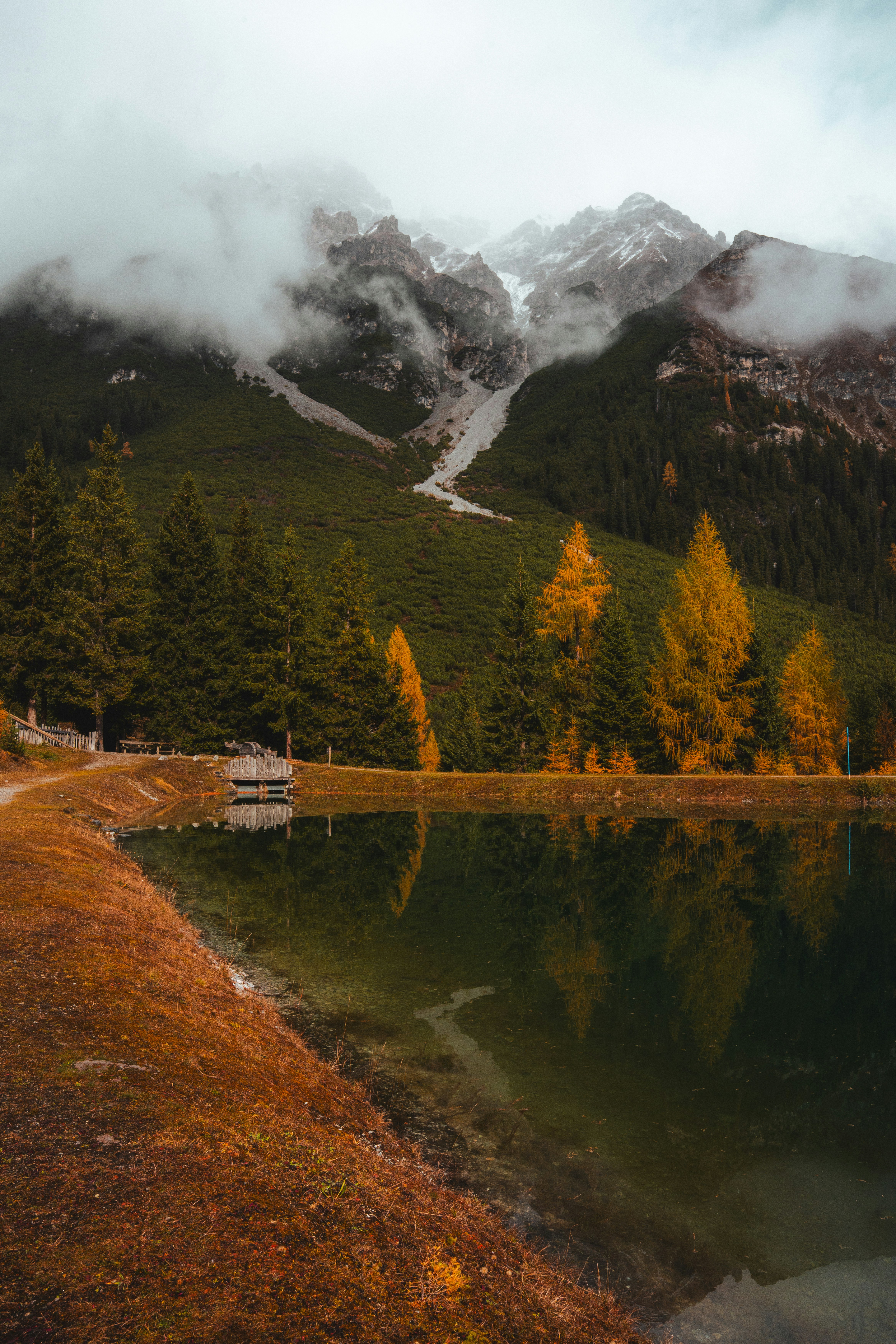 Autumn Ridge Reflections at the Misty Foot of the Peaks