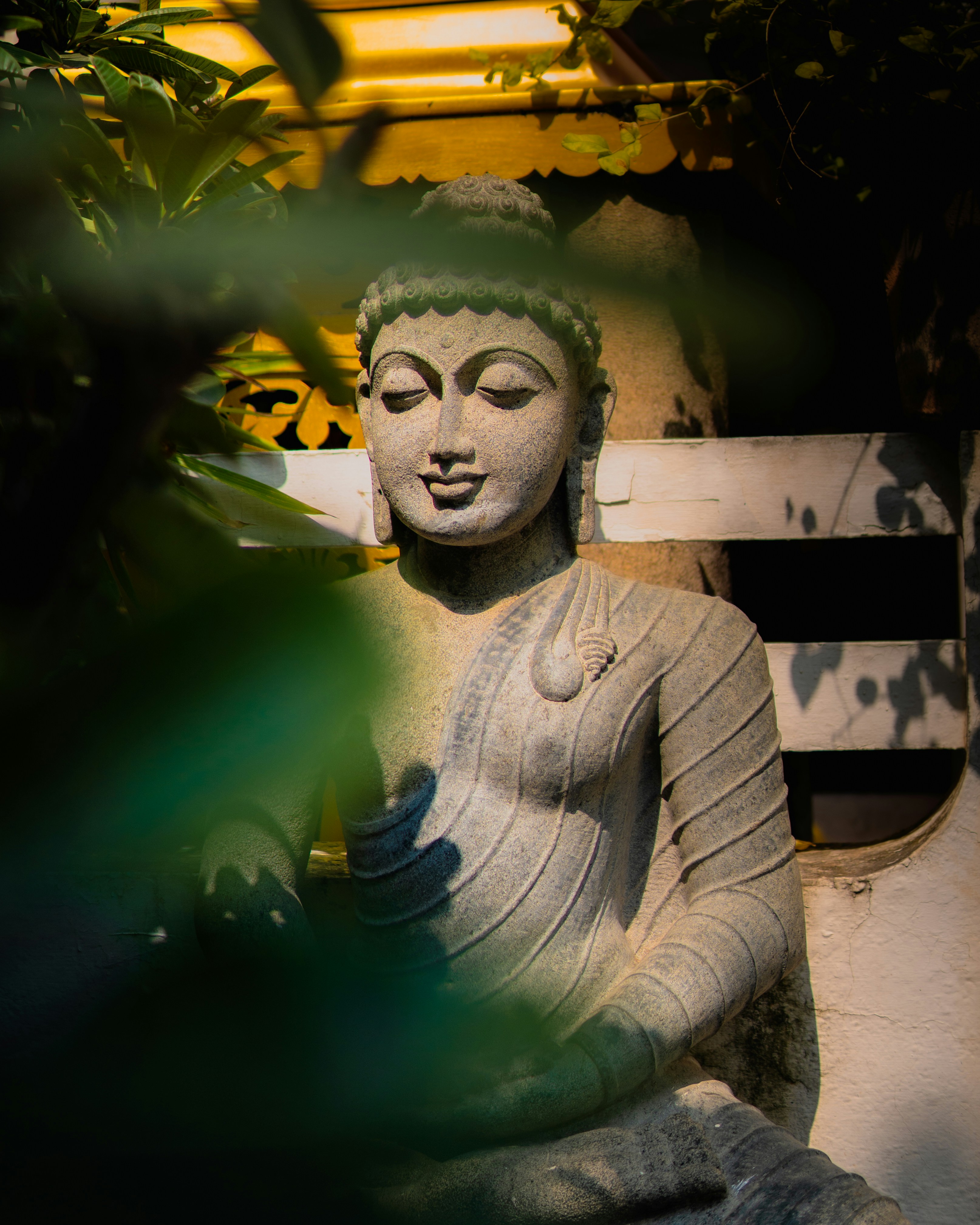 Serene Stone Bodhisattva Hidden in Quiet Foliage