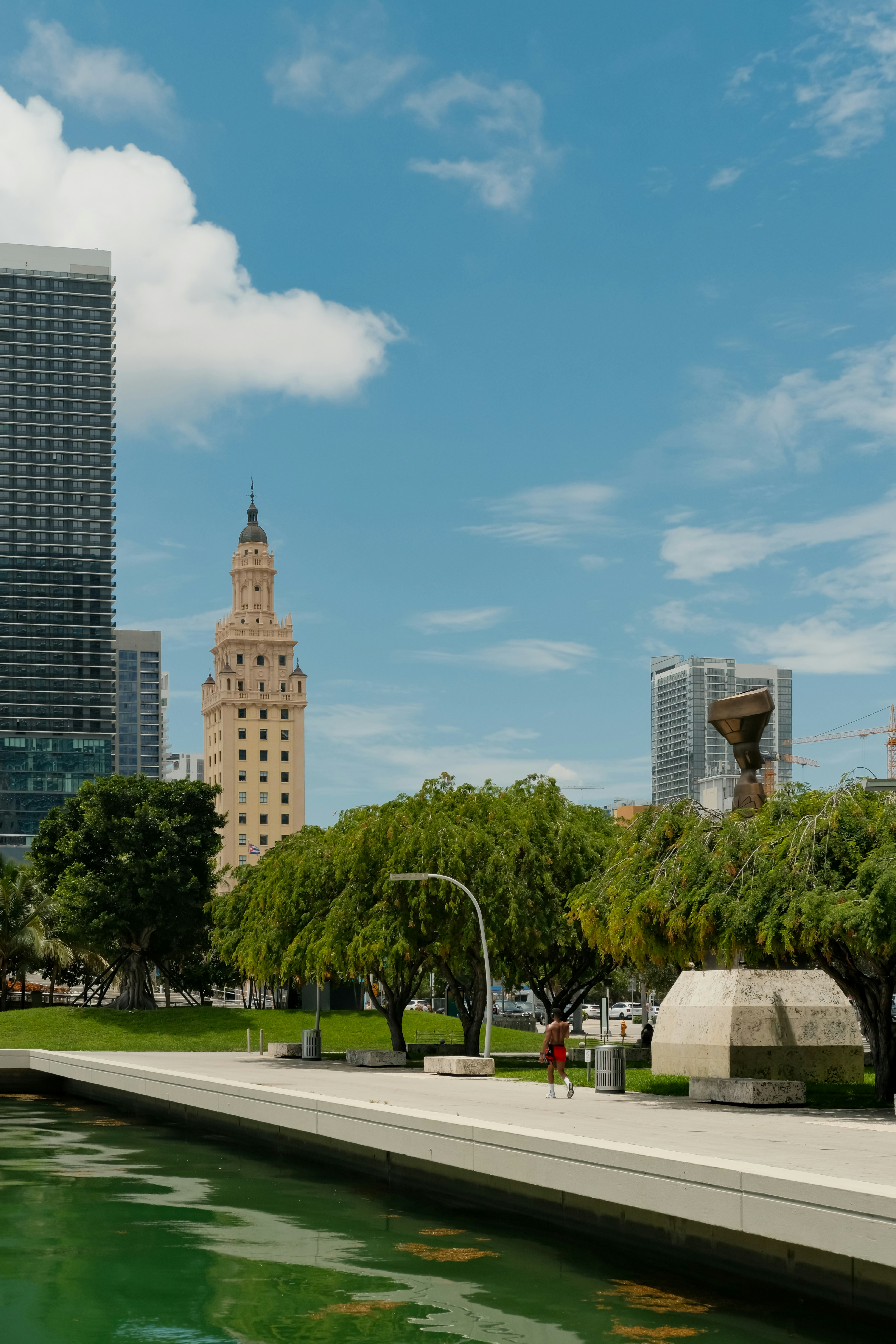 Urban Skyline Meets Riverside Promenade