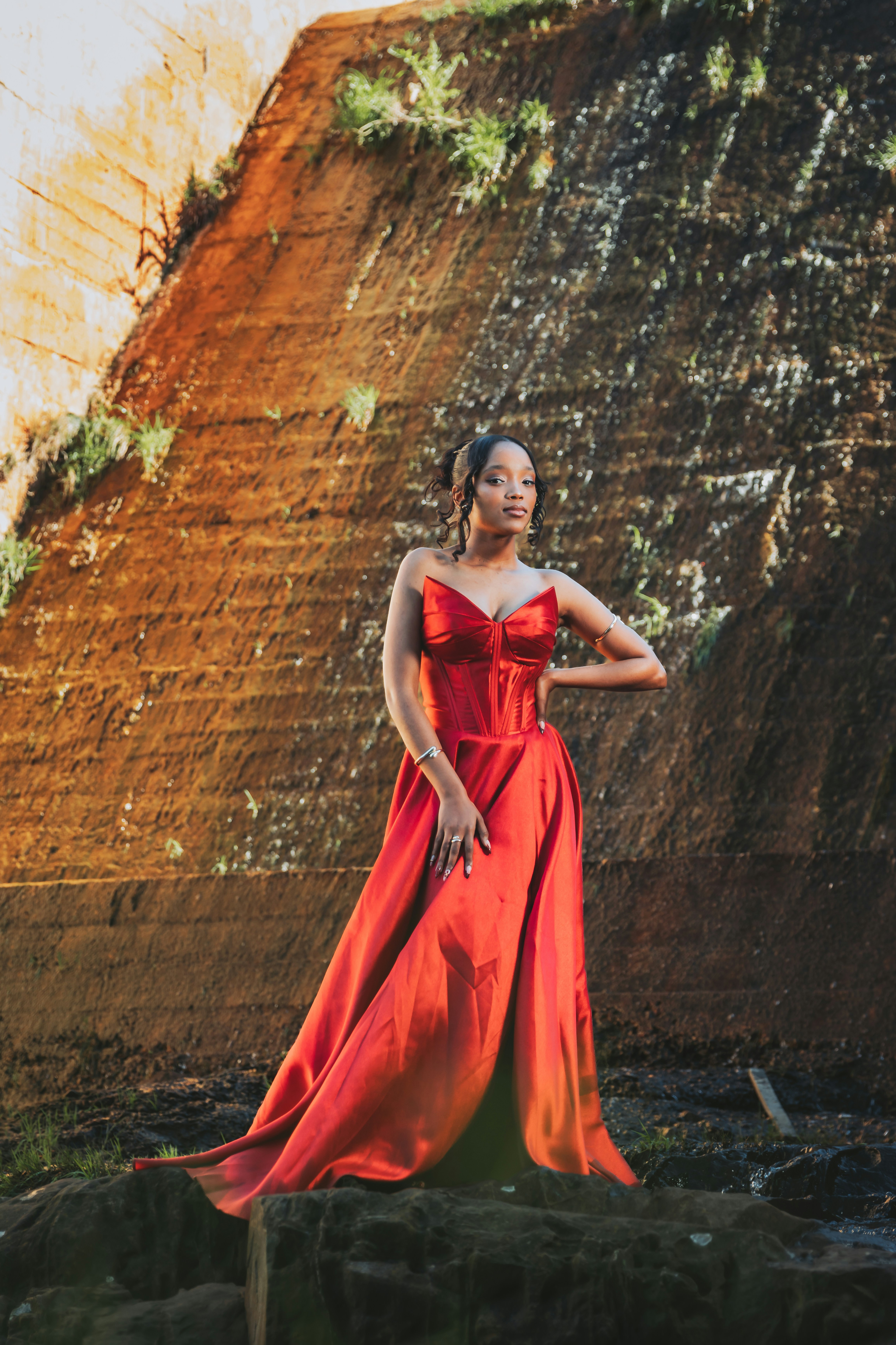 Red Velvet Elegance by the Riverside Cliff